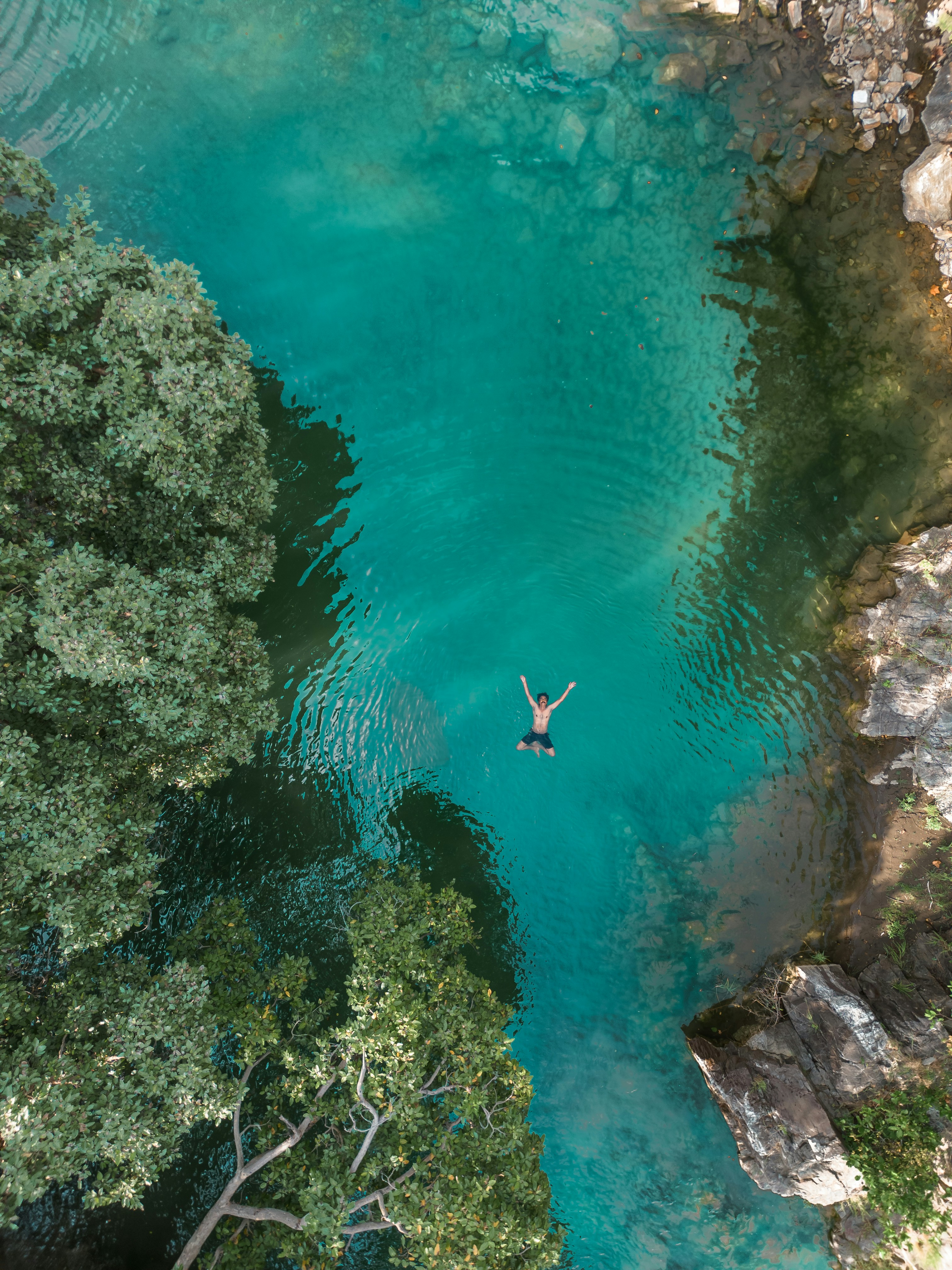 Emerald Heart: A Swimmer Silhouette in a Turquoise Cenote