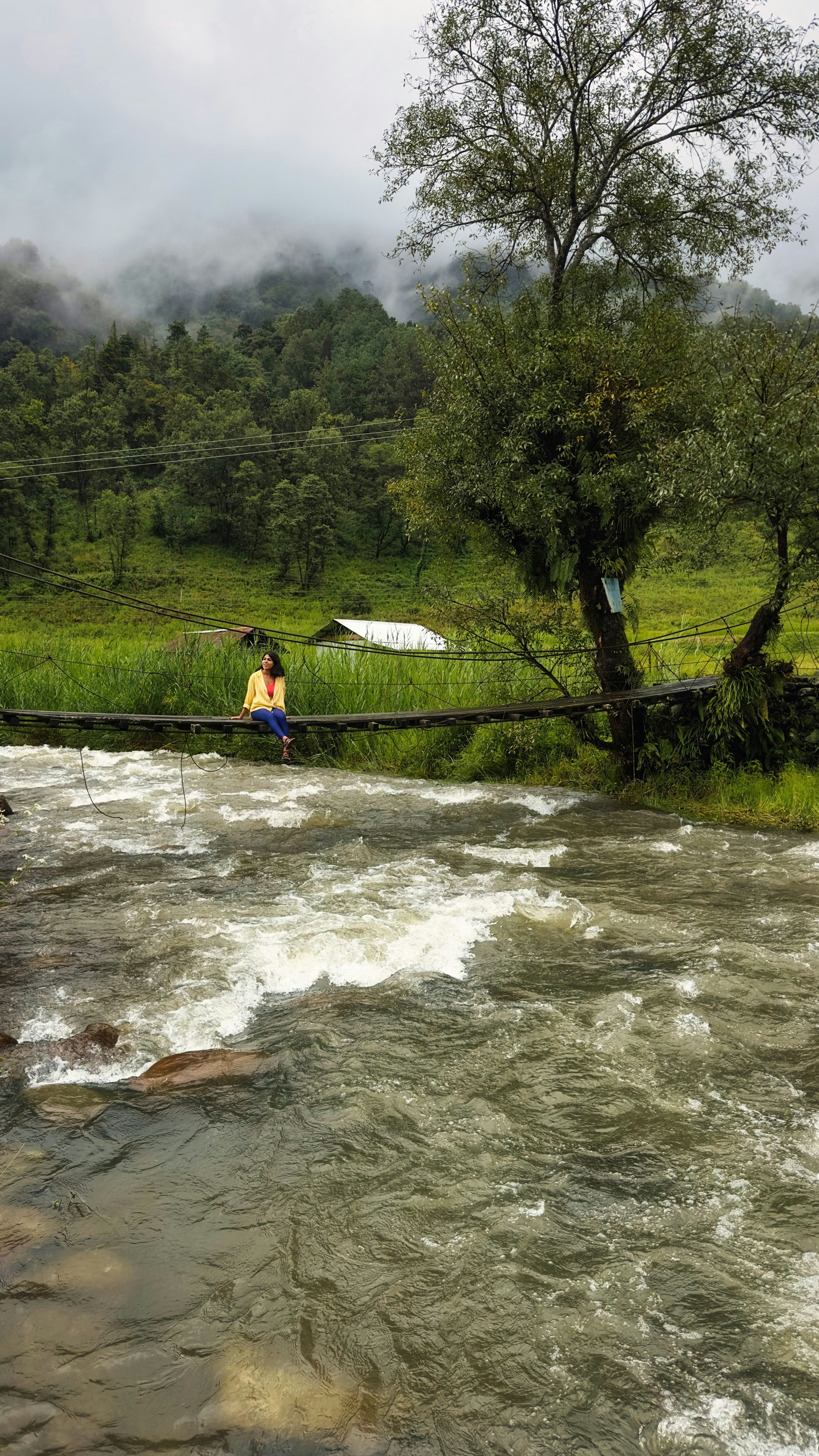 A Suspended Moment Over the River: Traveler on a Rope Bridge