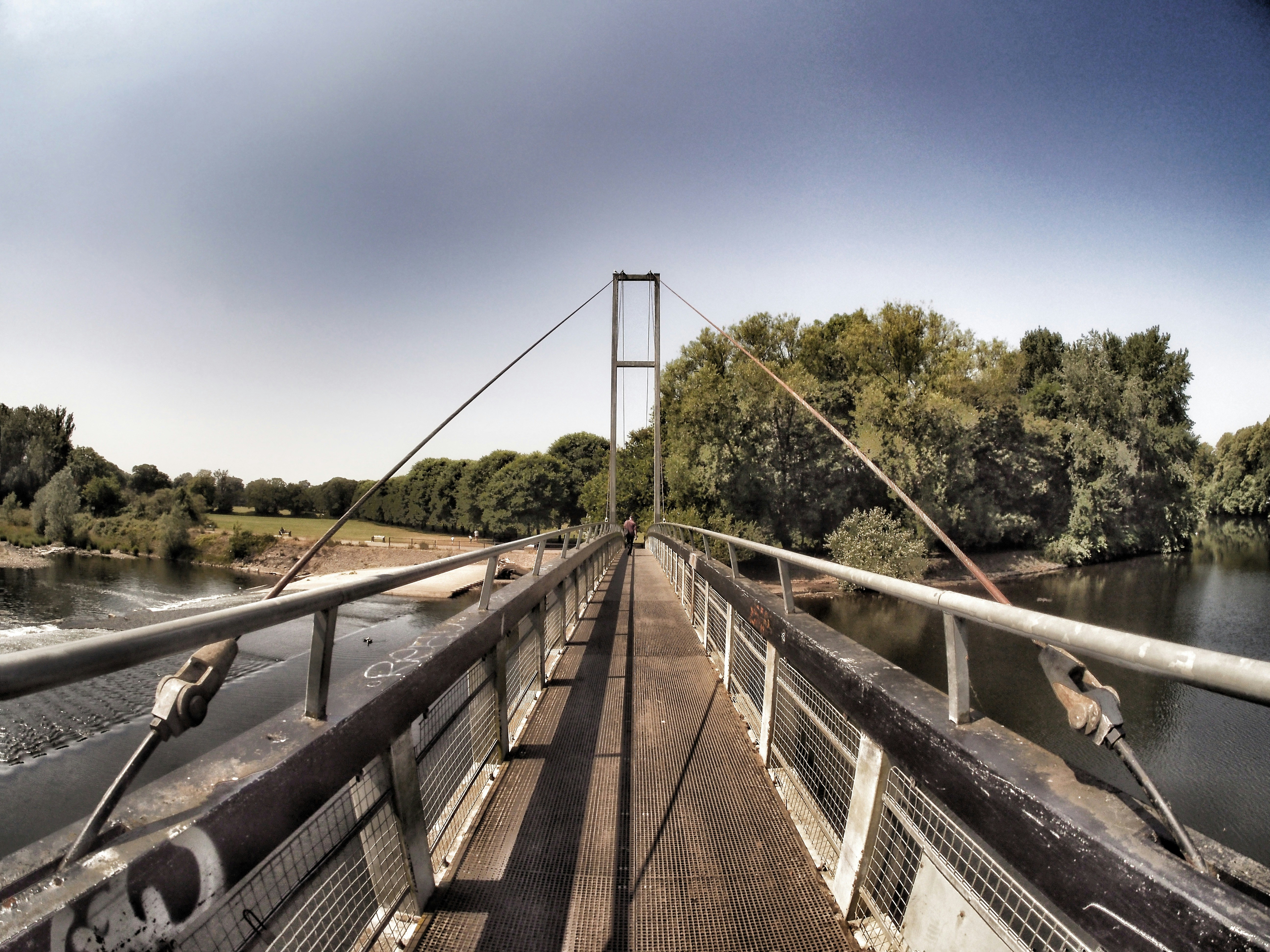 Bridging Horizons: A River Suspension from the Pedestrian Deck