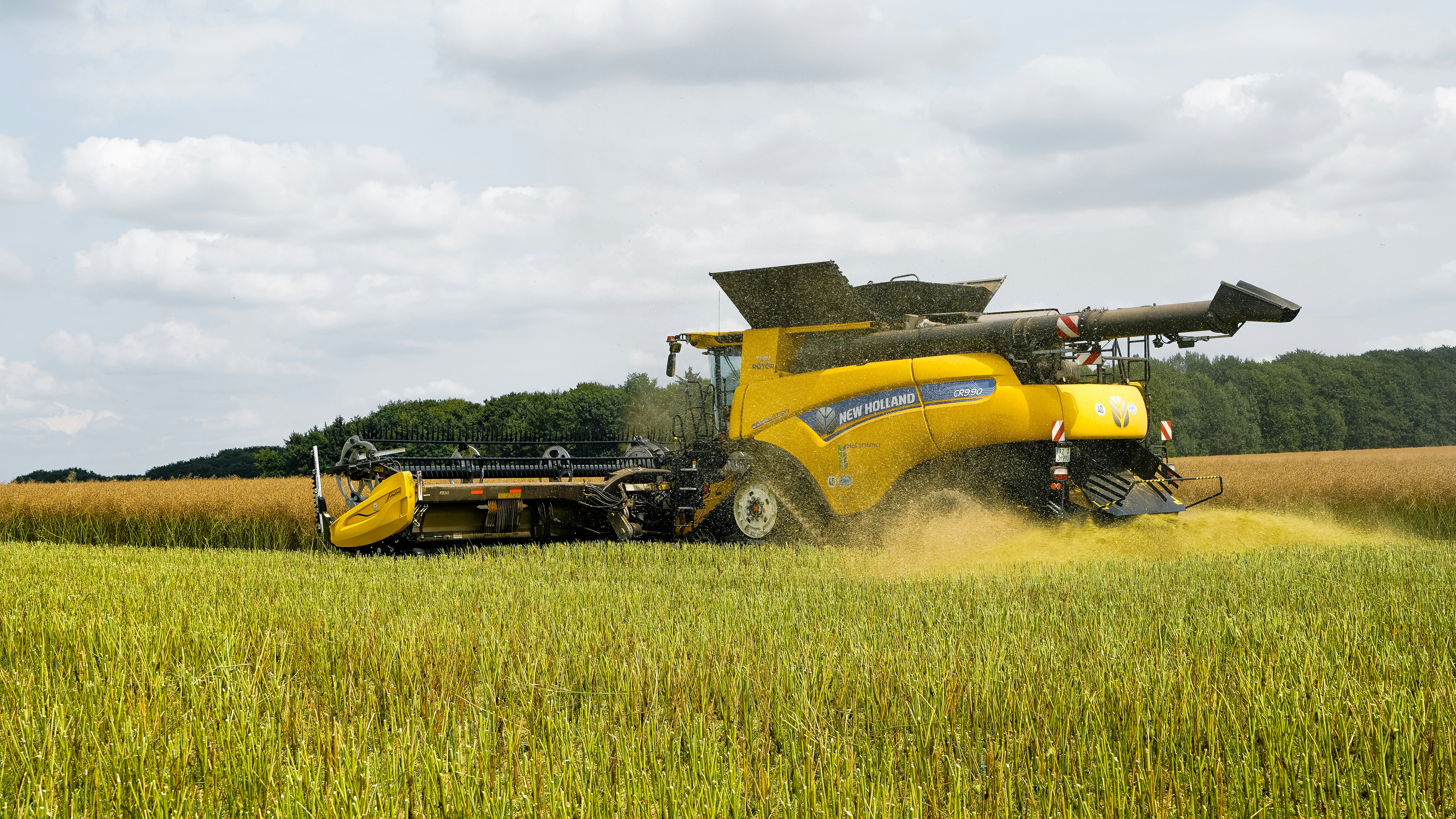 Gold Harvester in a Dusty Harvest Field
