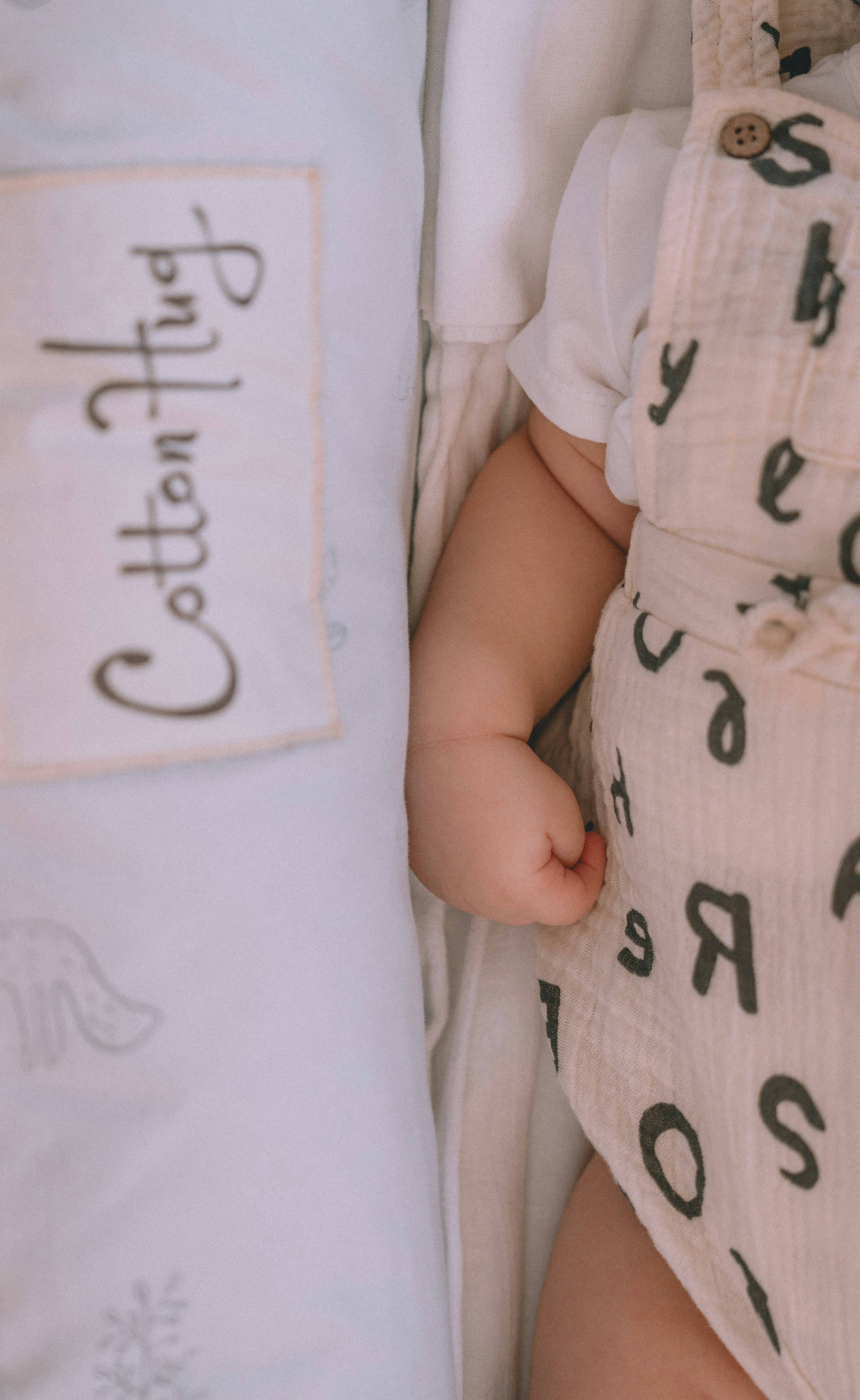Soft Sunrise in Tiny Hands: A Gentle Moment of Infant Comfort