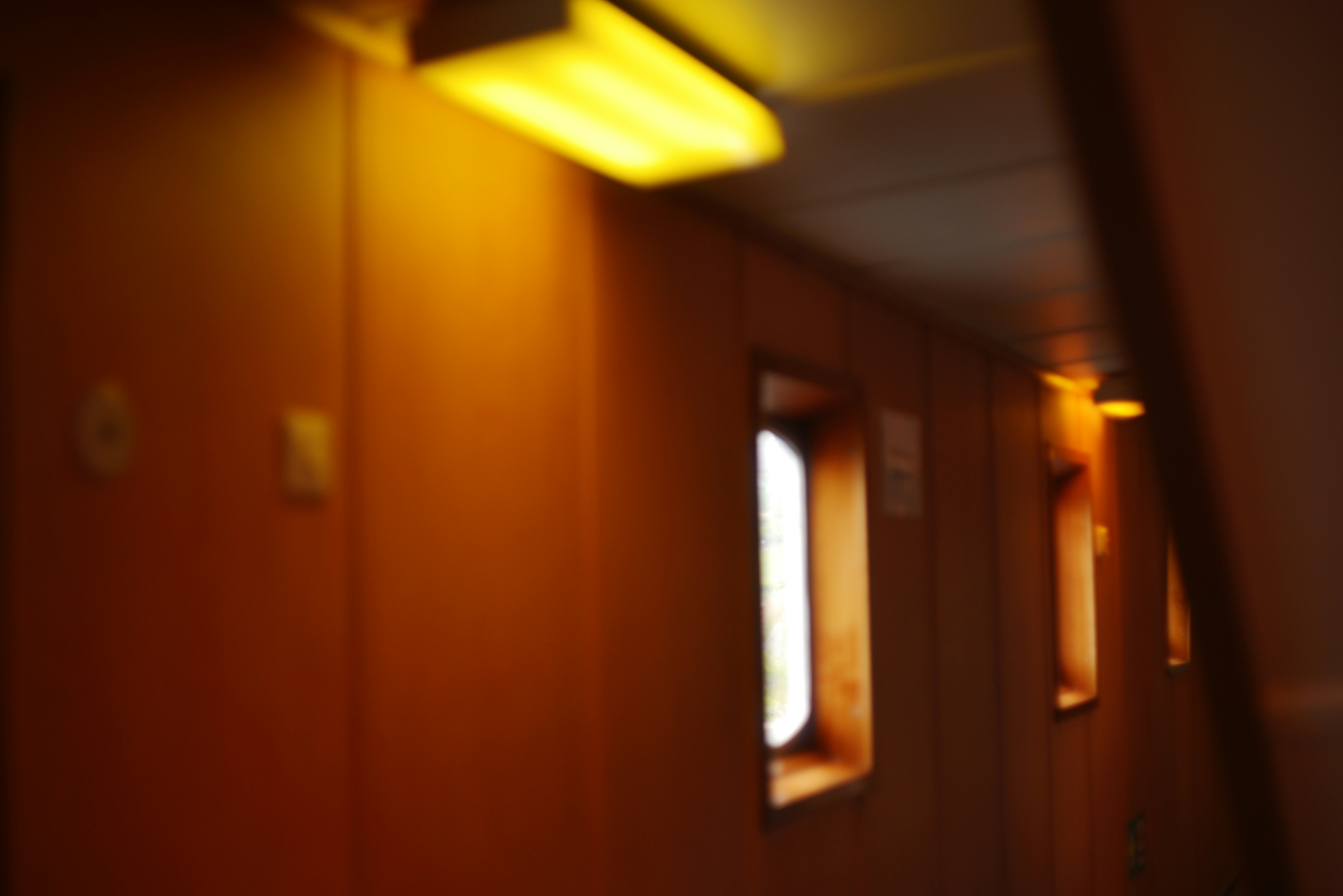 Dim Hallway Glows: A Quiet Run Through the Cabin Corridor