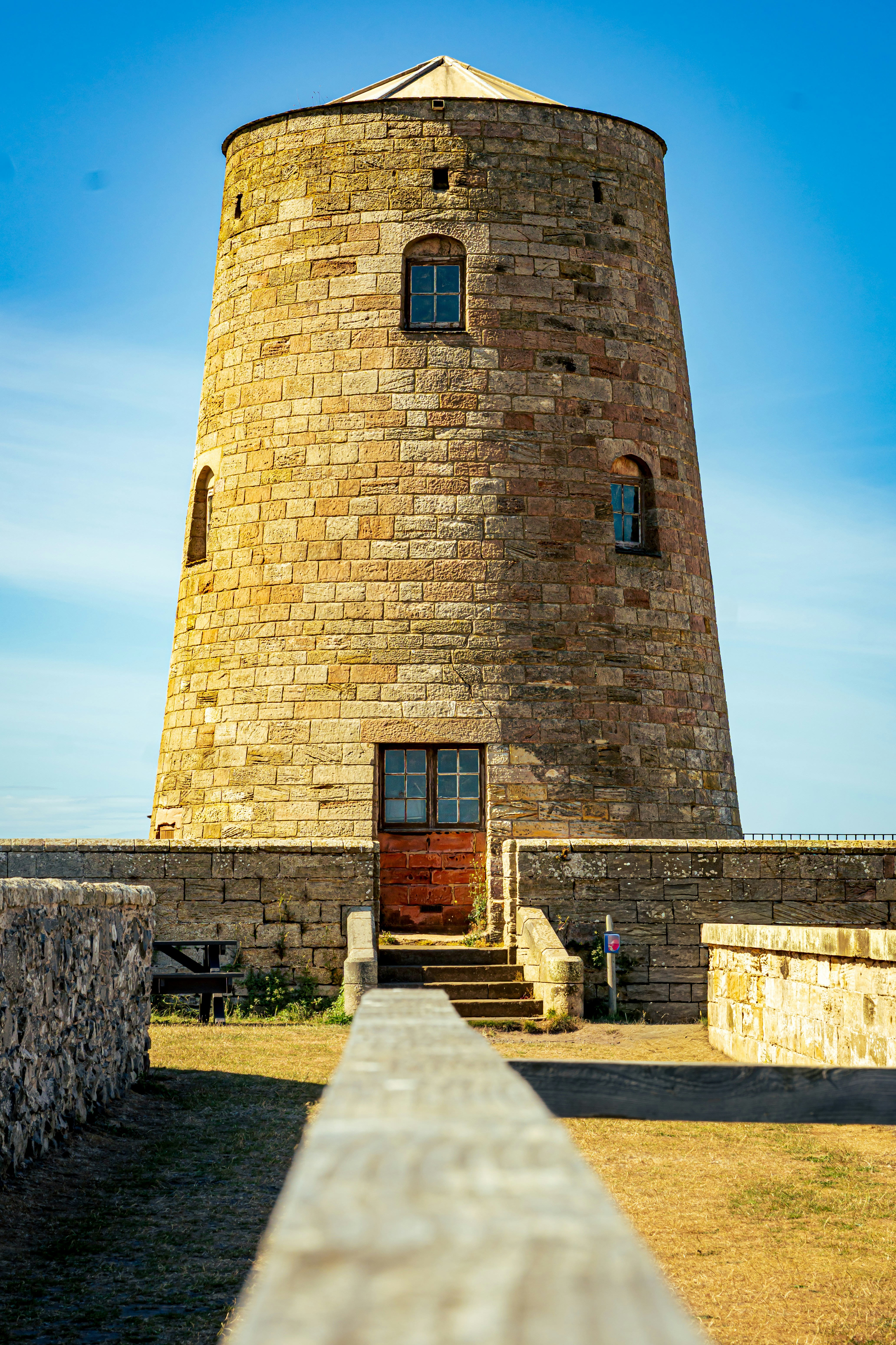 Cylinder of Stone: A Medieval Lookout Rising Against a Clear Sky