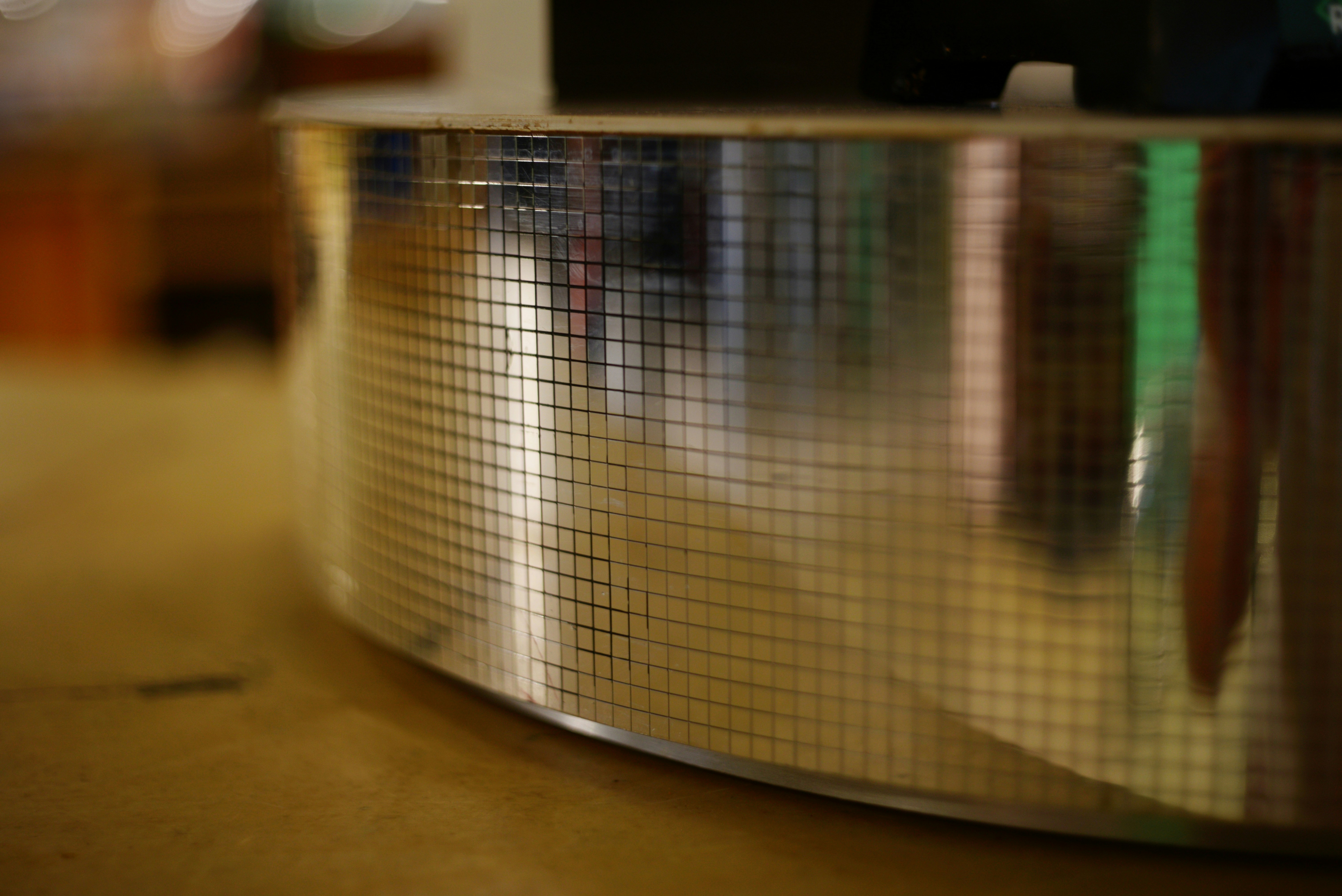 Polished Cylinder, Refracted Grid: A Quiet Reflection