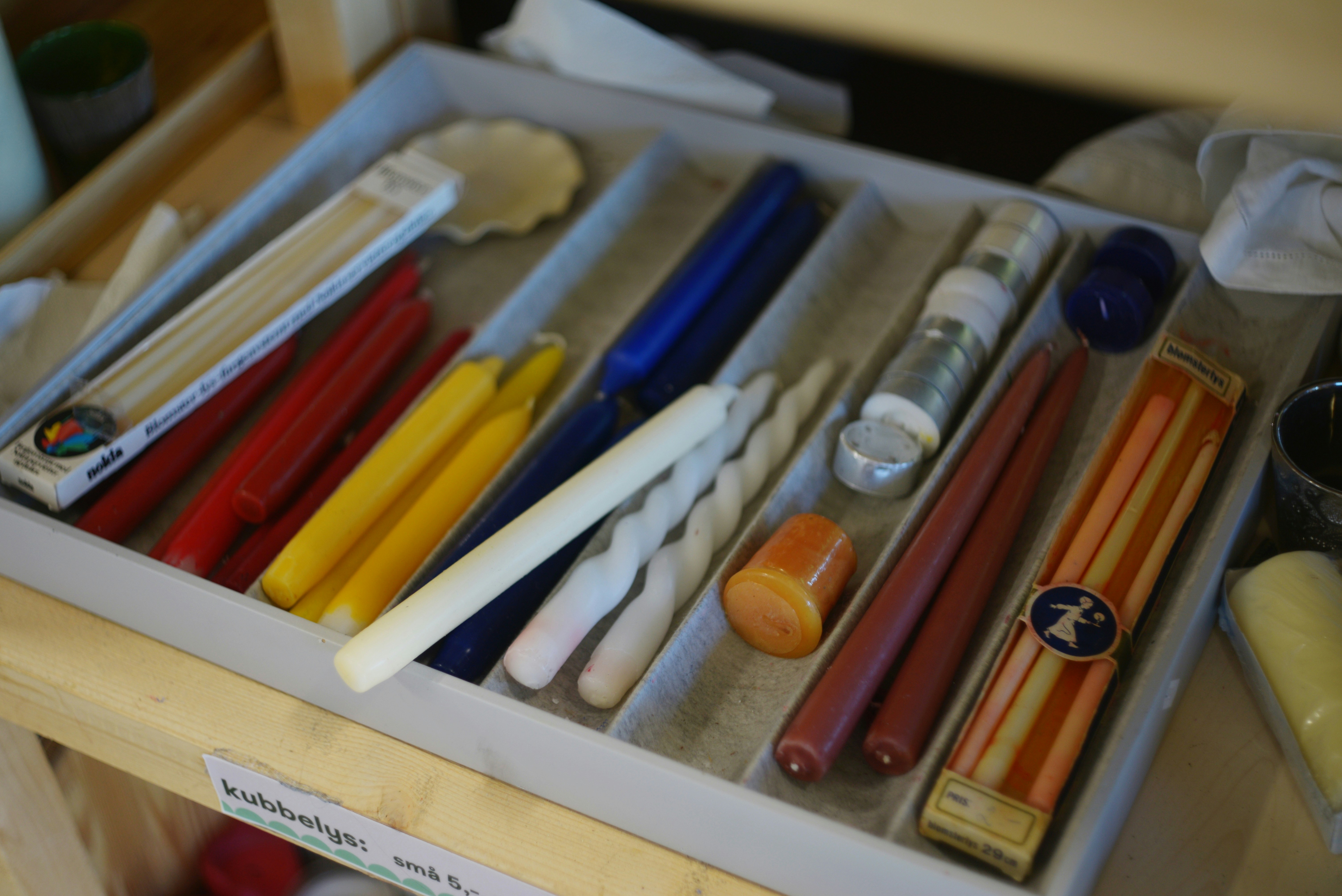 A Palette of Crafting Tools Resting in a Quiet Drawer