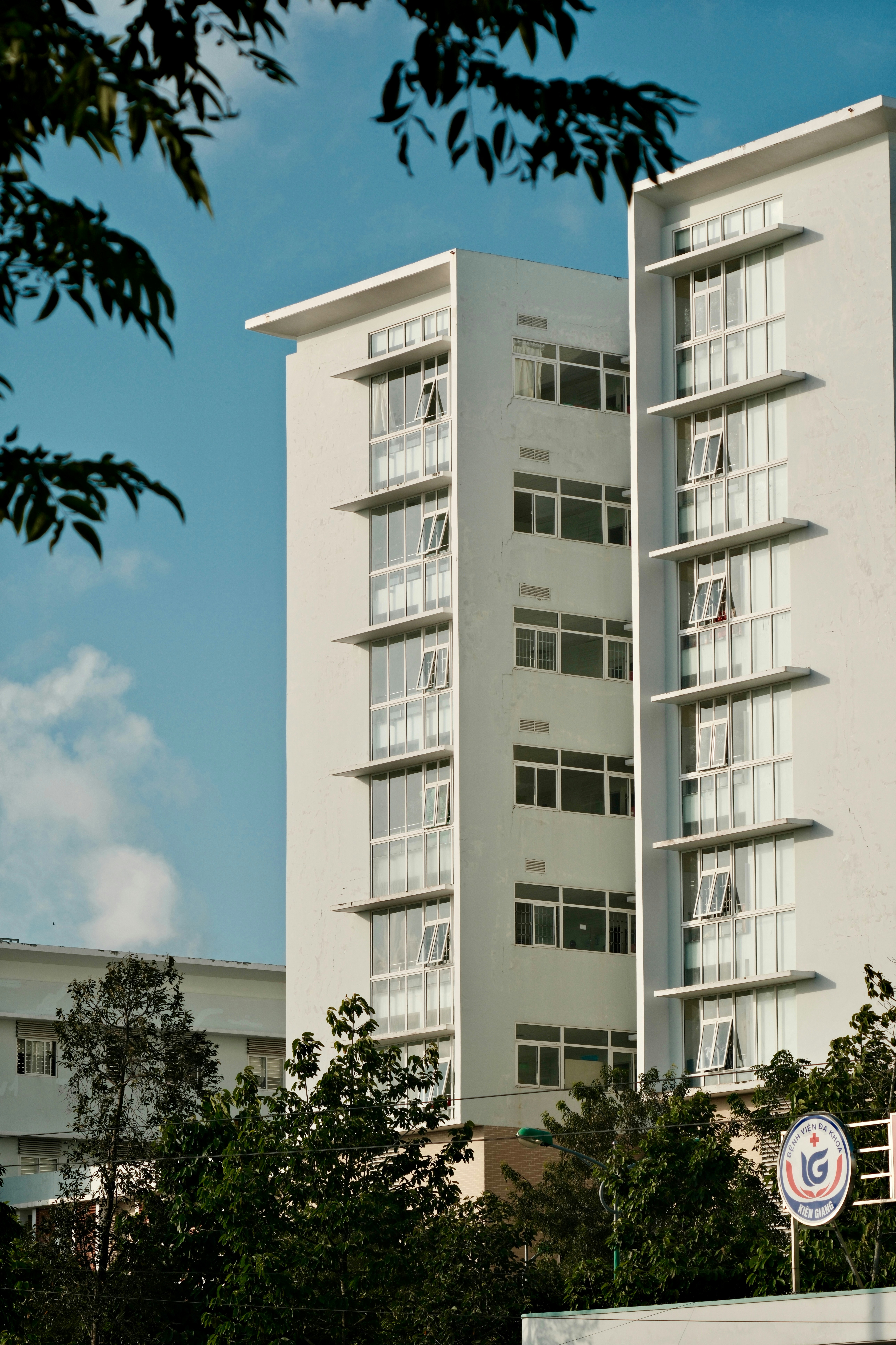 Vertical Campus: White Facades Against a Clear Blue Sky