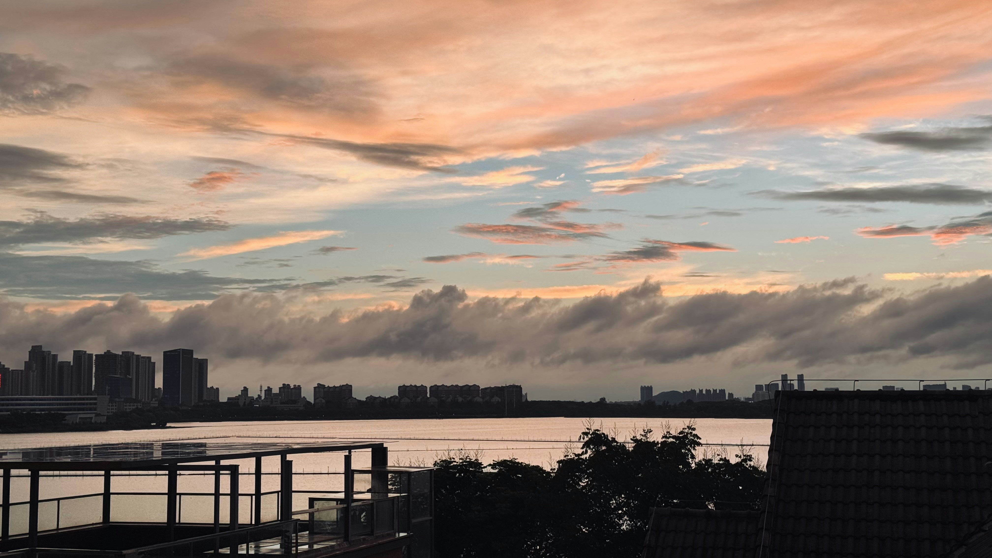 Twilight Over the River: City silhouettes at dusk