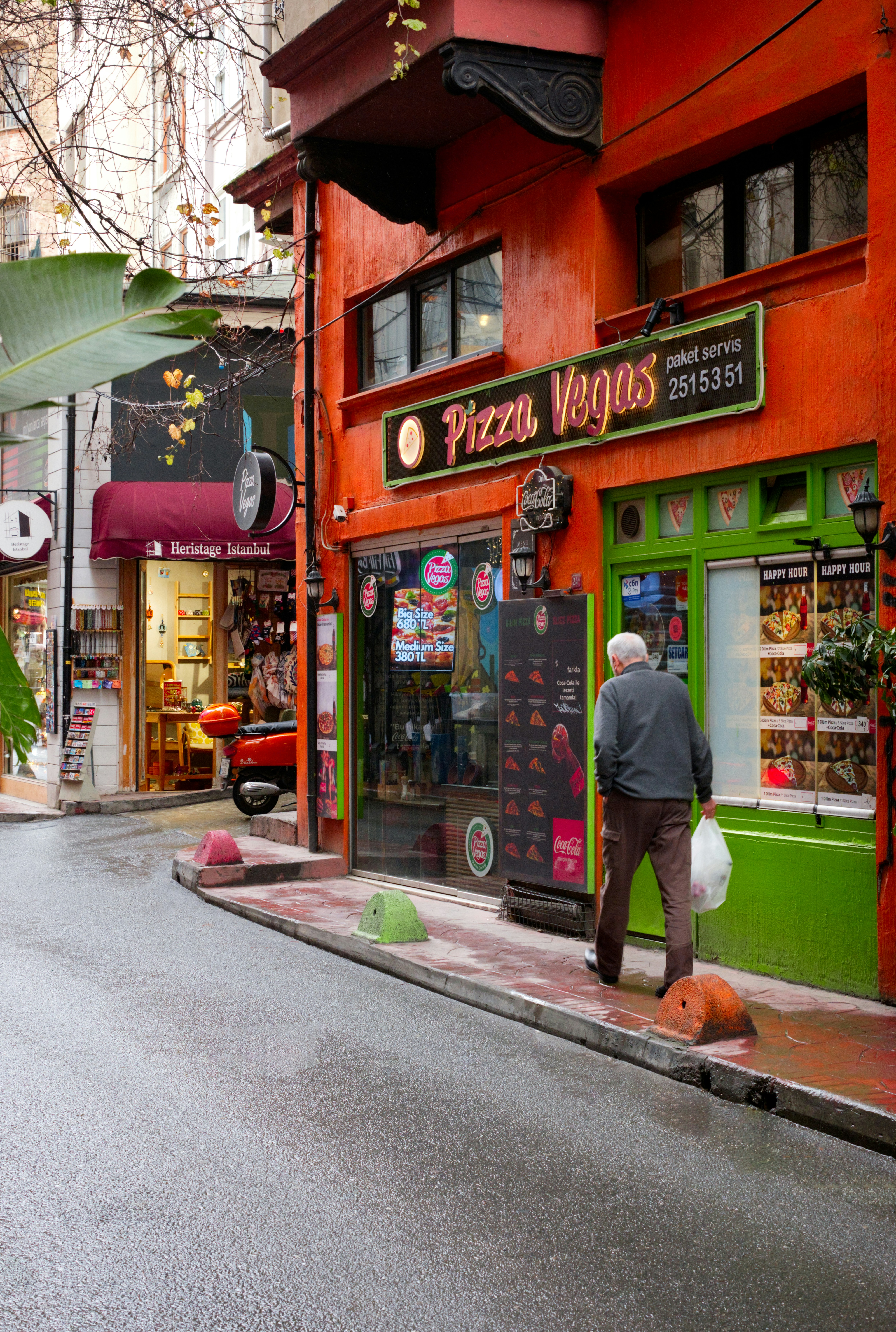 Pizza Vegas on a Rain-kissed Street
