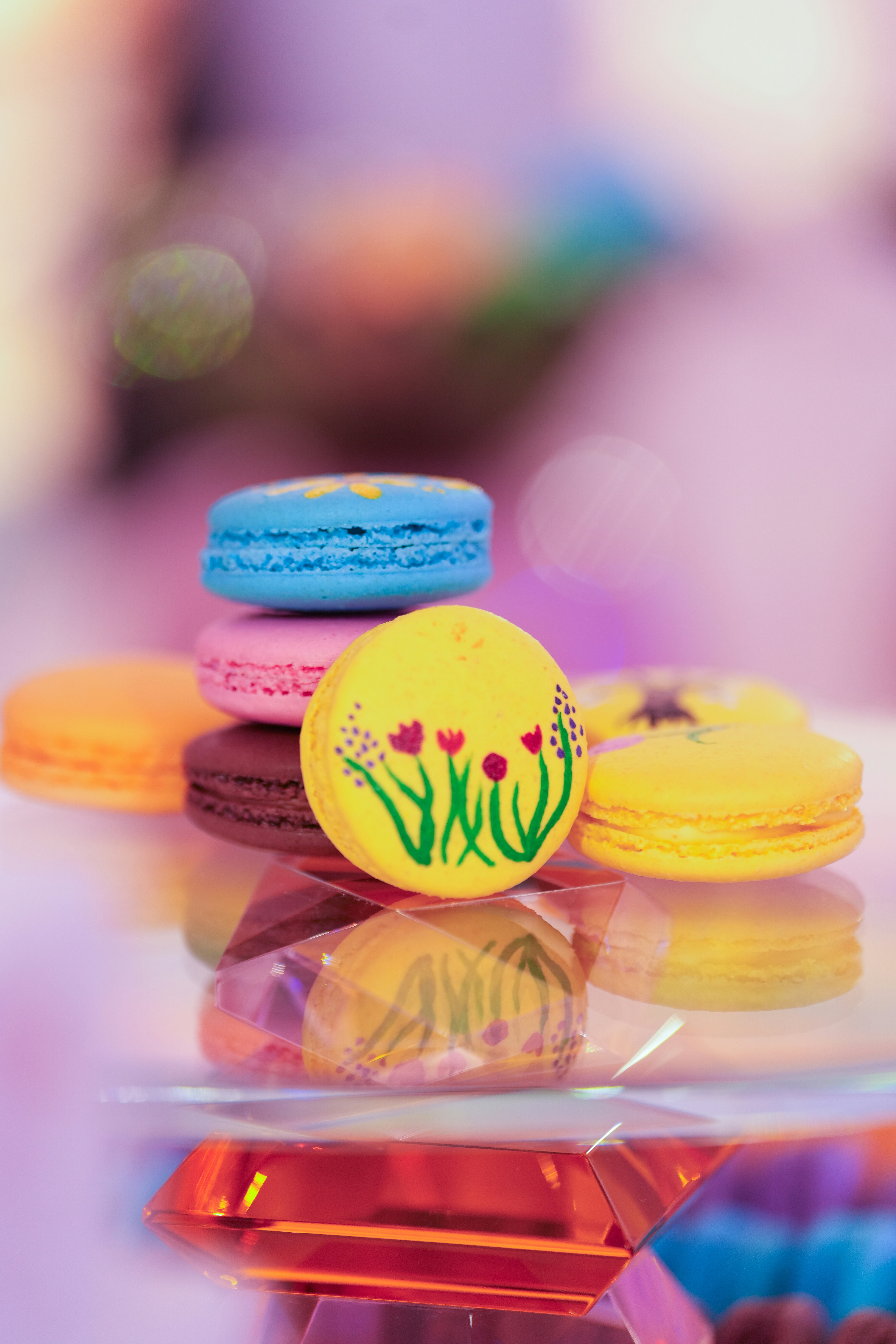 Candy Colors in Focus: Stacked Macarons Crowned by a Painted Yellow Coin