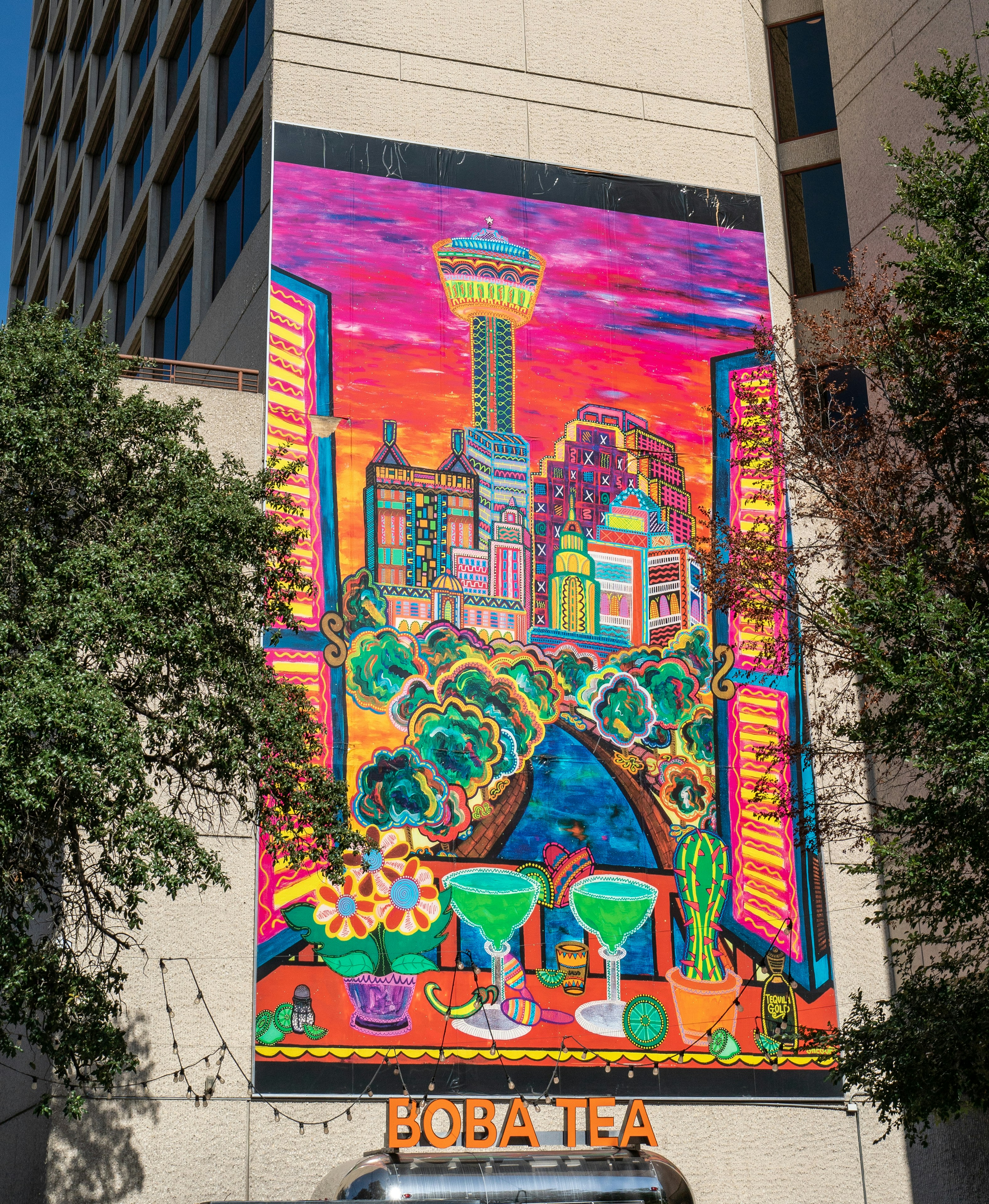 Neon Oasis: A City of Colorful Reflections on a Downtown Wall