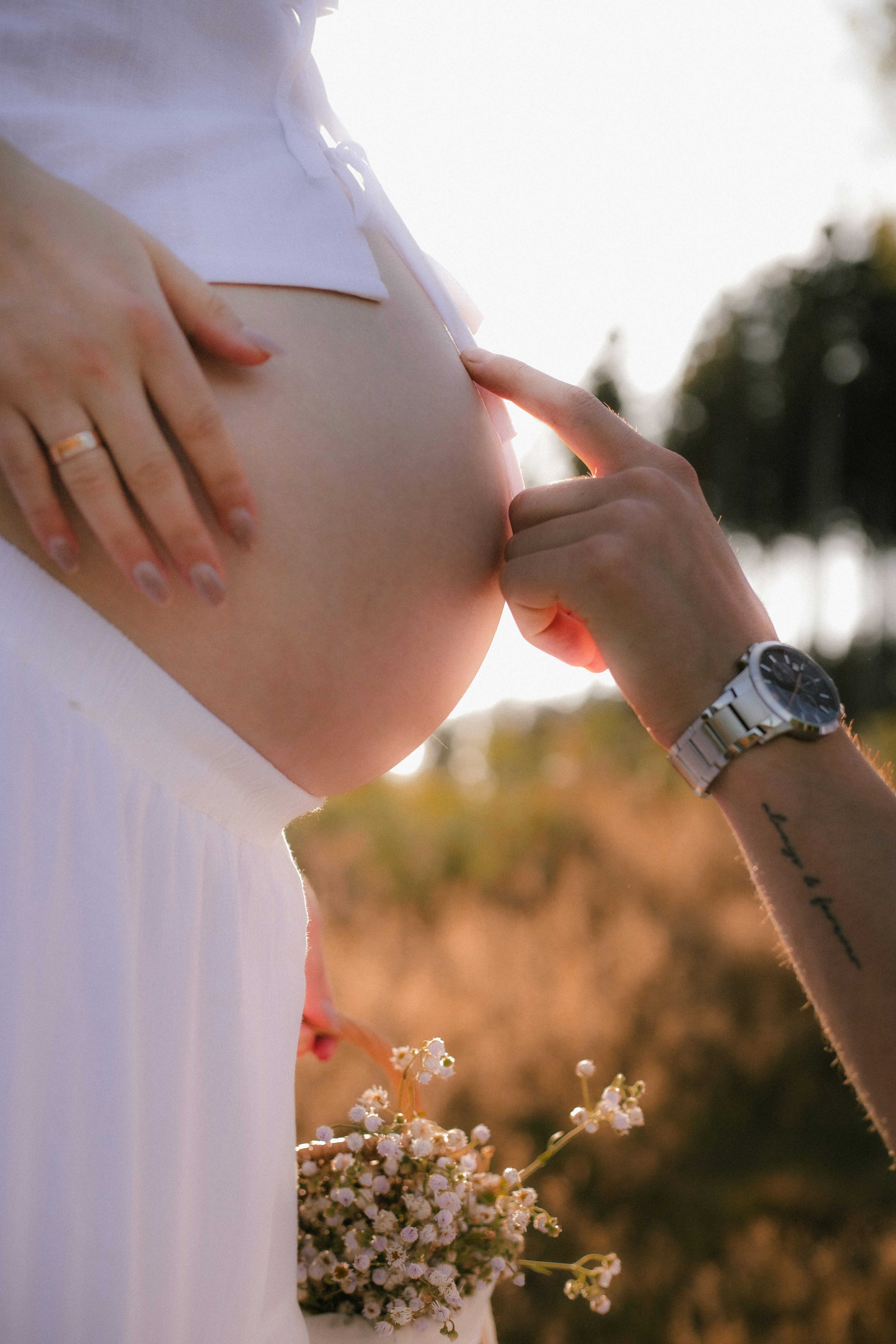 Parent’s Gentle Touch on Expectant Moment