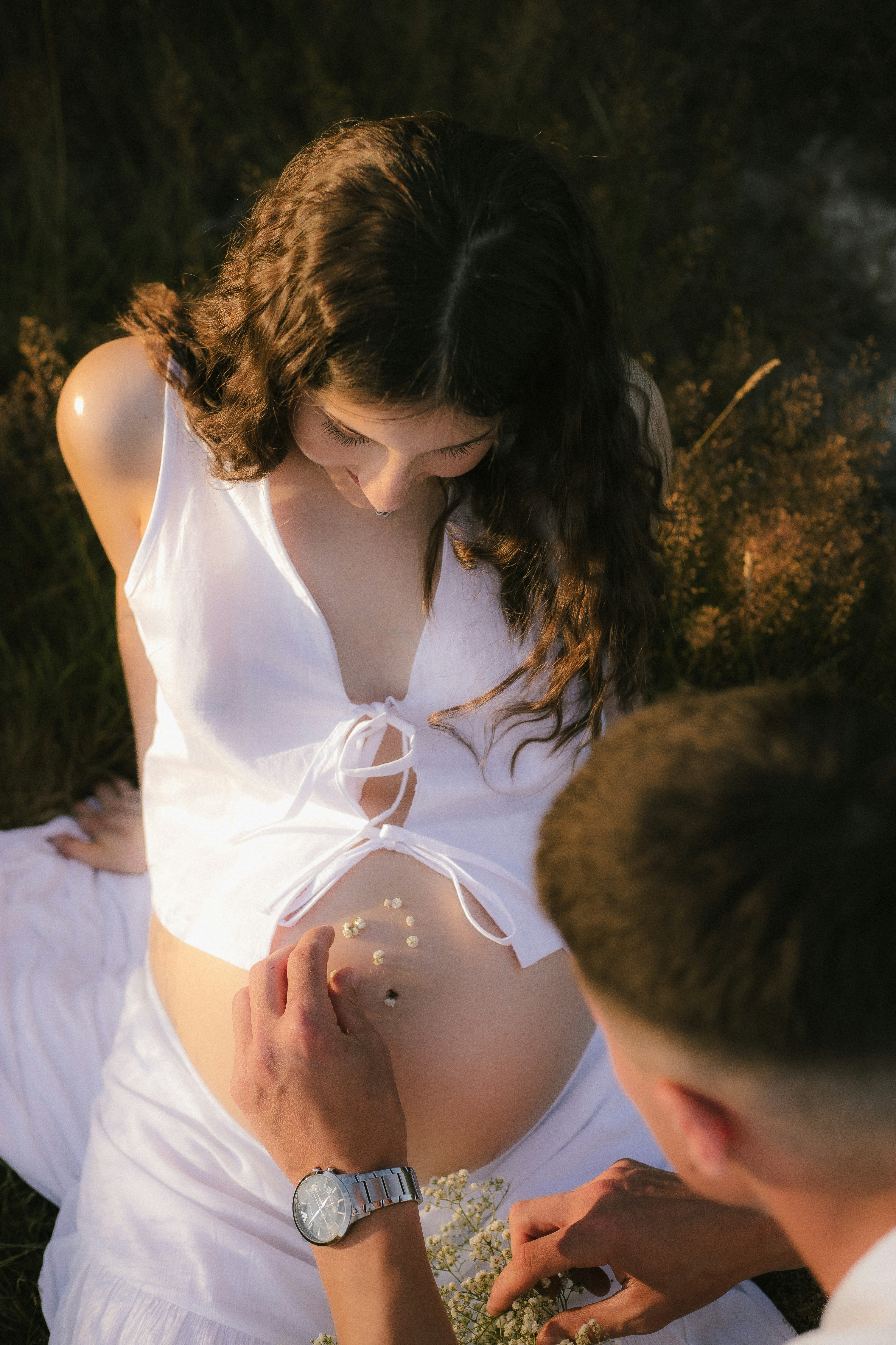 Sunlit Promise: A Quiet Moment Between Mother and Partner