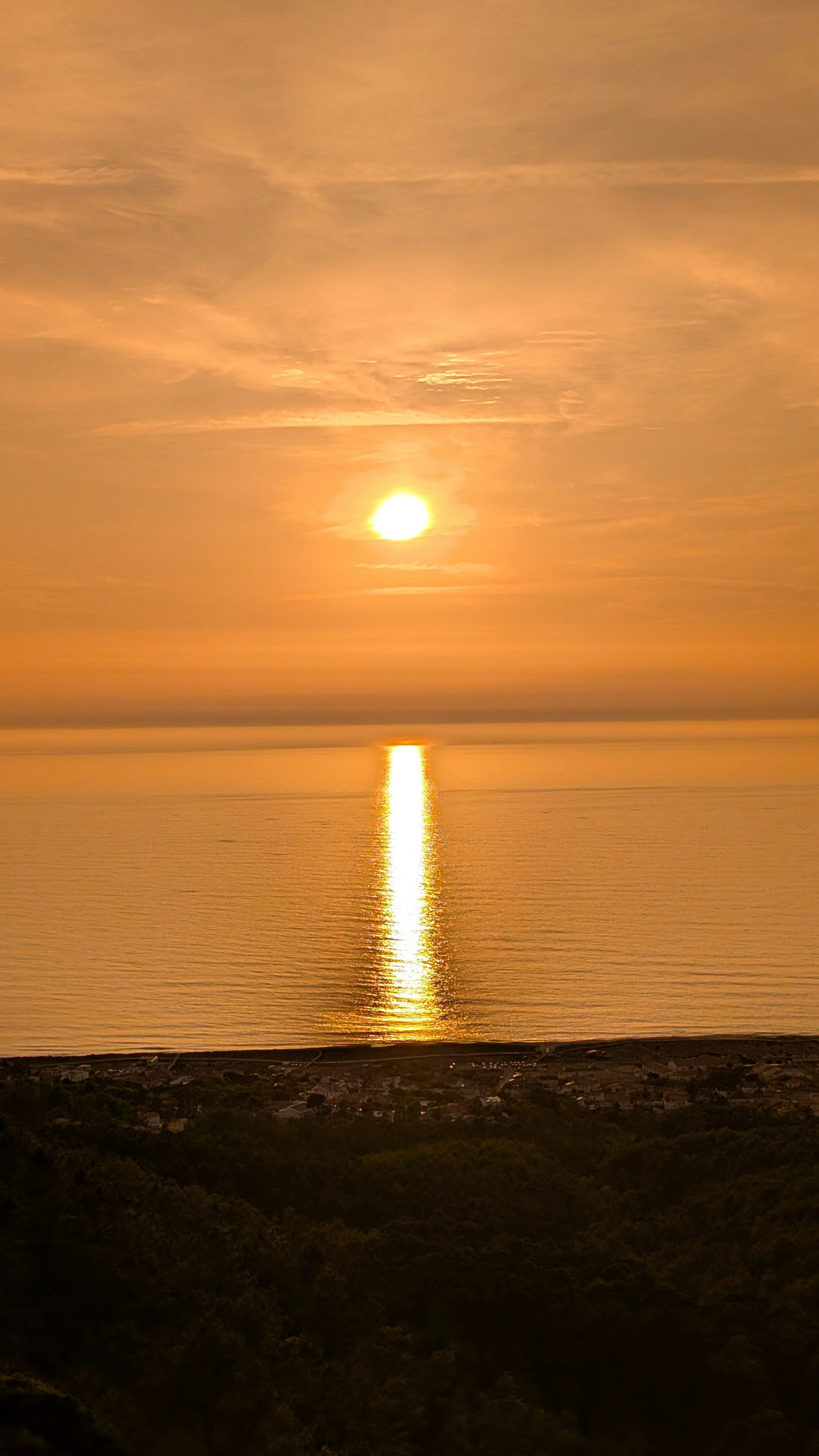 Vertical Sunset Serenade Over Quiet Waters