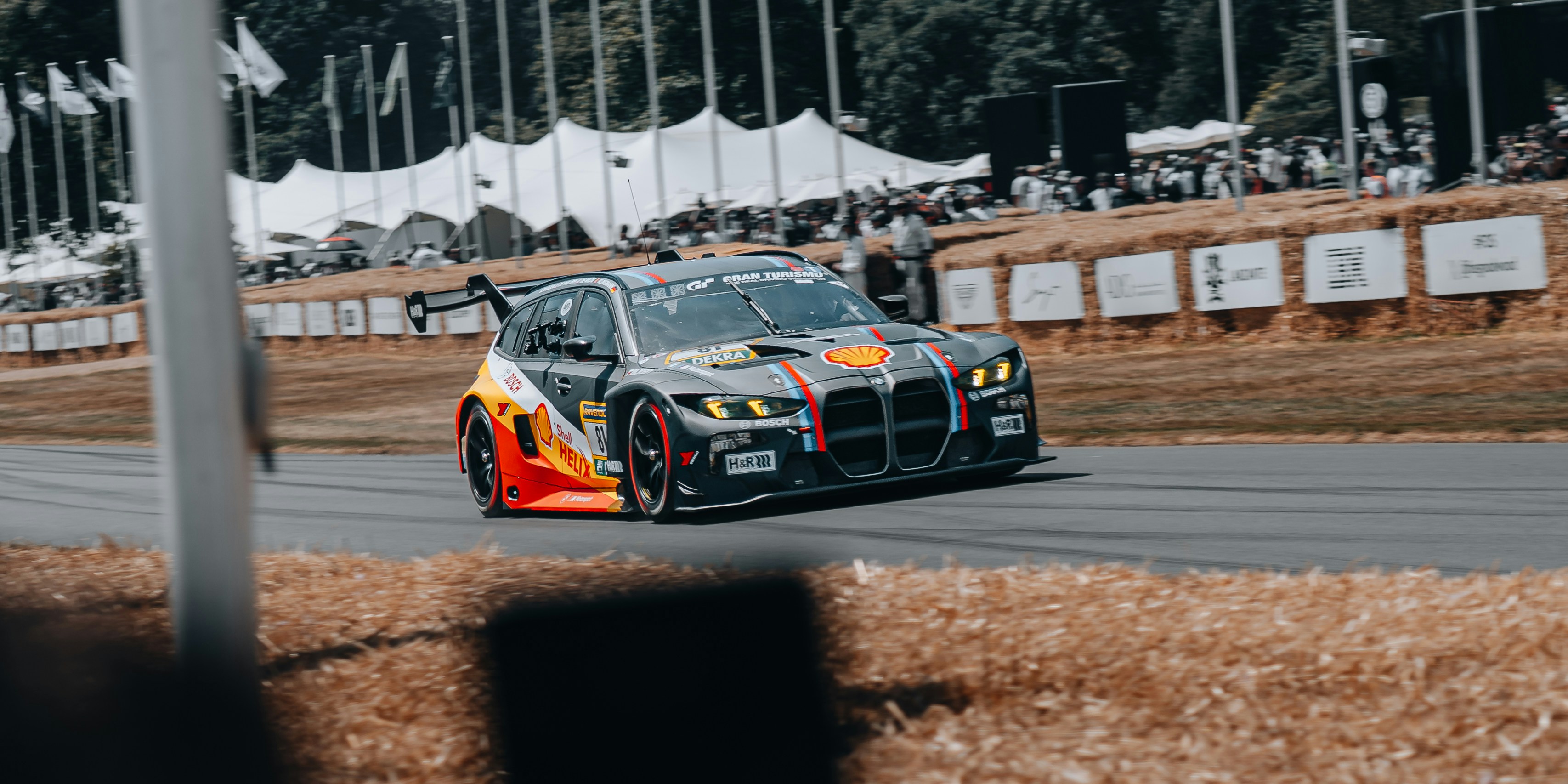 Flames and Velocity: A Race-Scarred Audi Powers Through the Track
