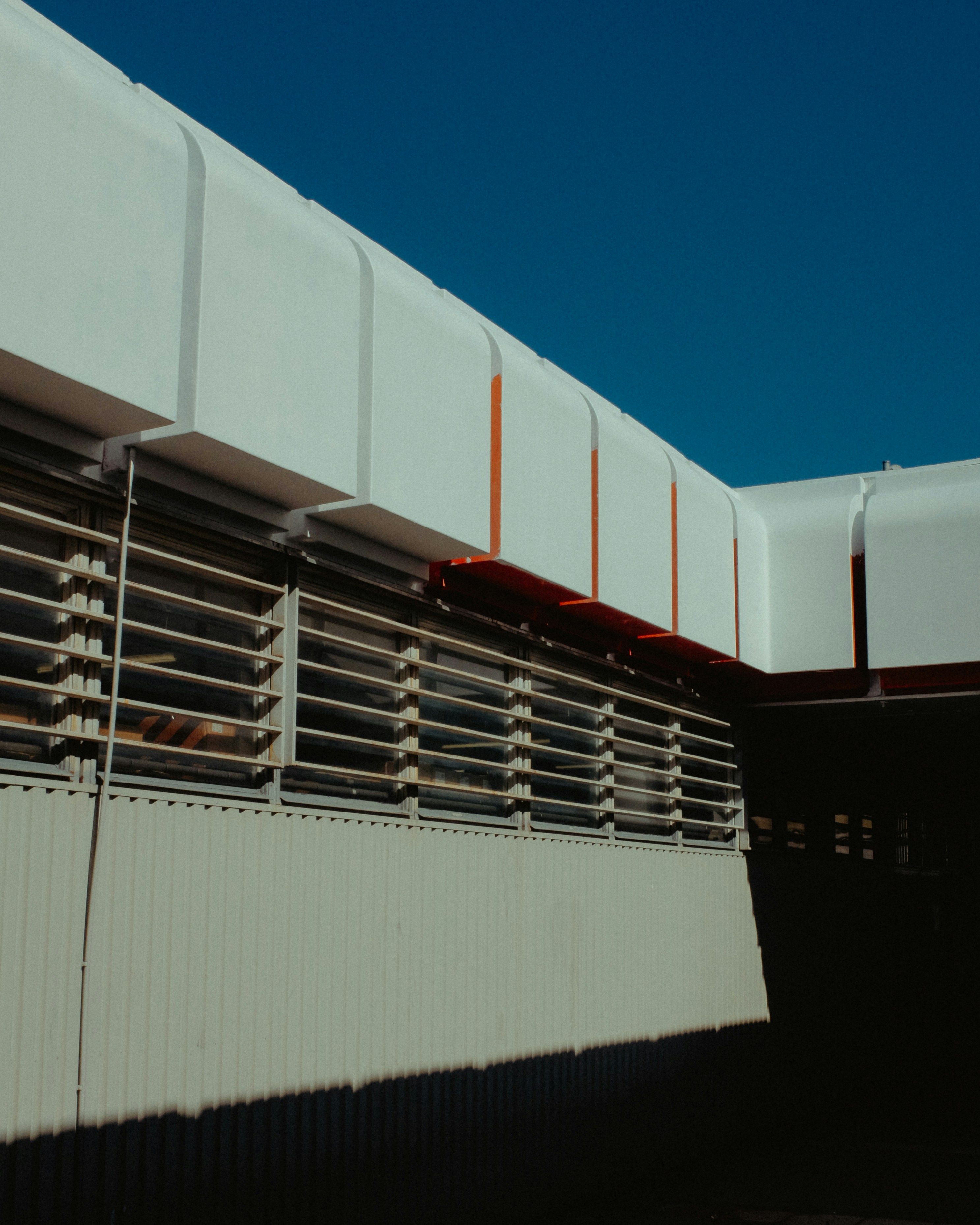Angular Vent Lines Under a Clear Blue Sky