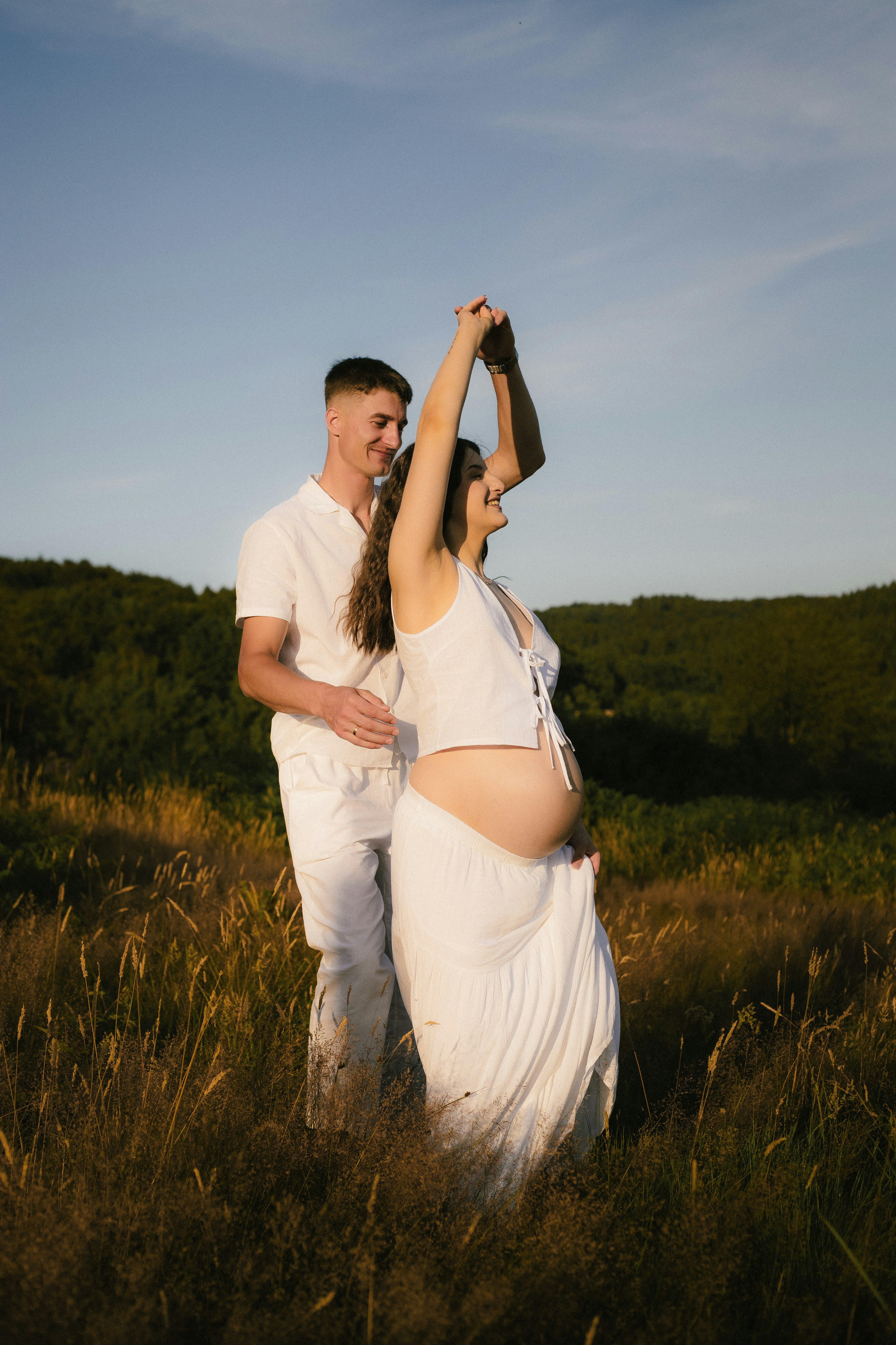 Embrace Under open skies: Expectant Glow in a Summer Field