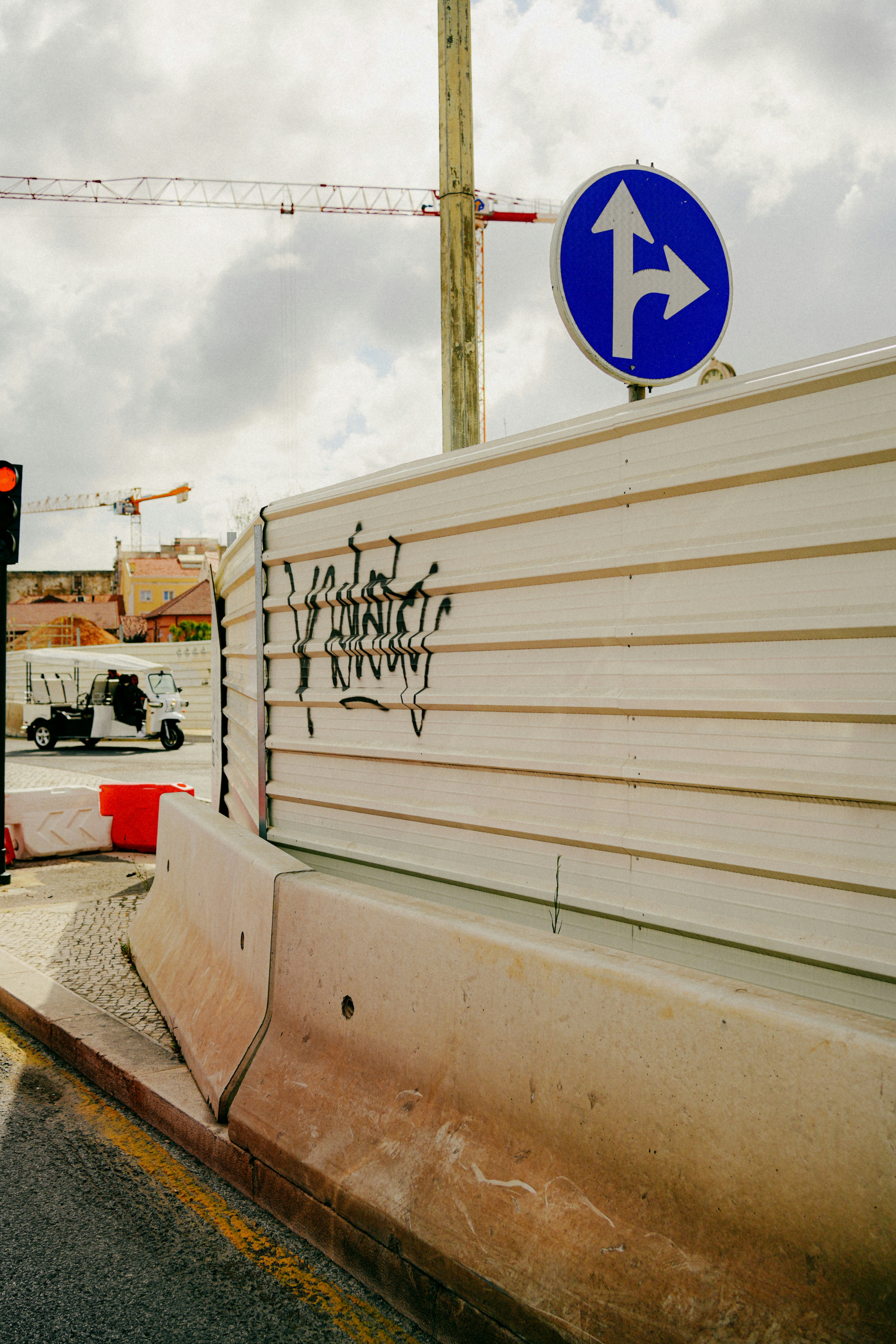 Construction Zone Sentinel: A Street Corner with Barriers and Signal