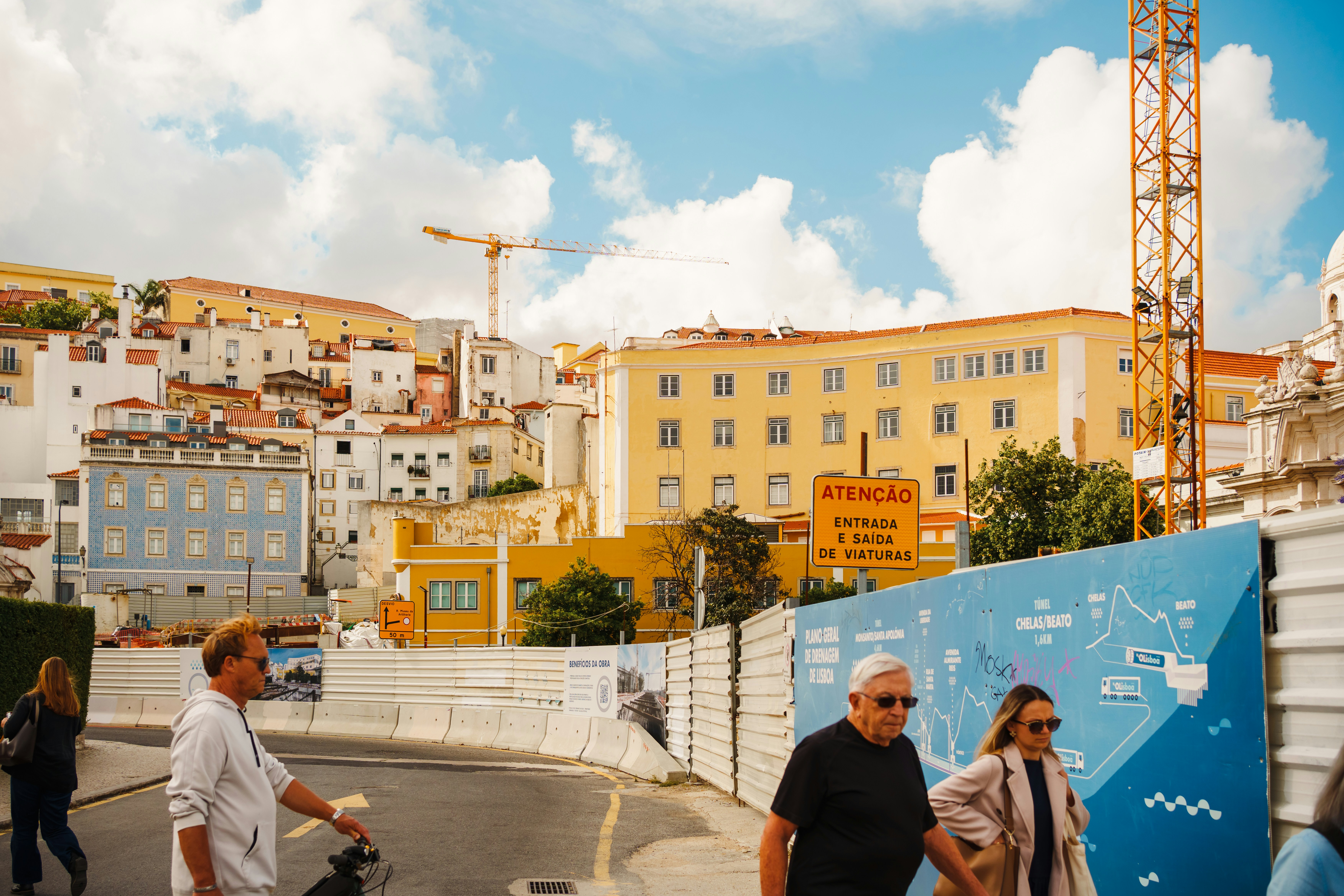 Sunny Street Crossing Under a Painted Cityscape