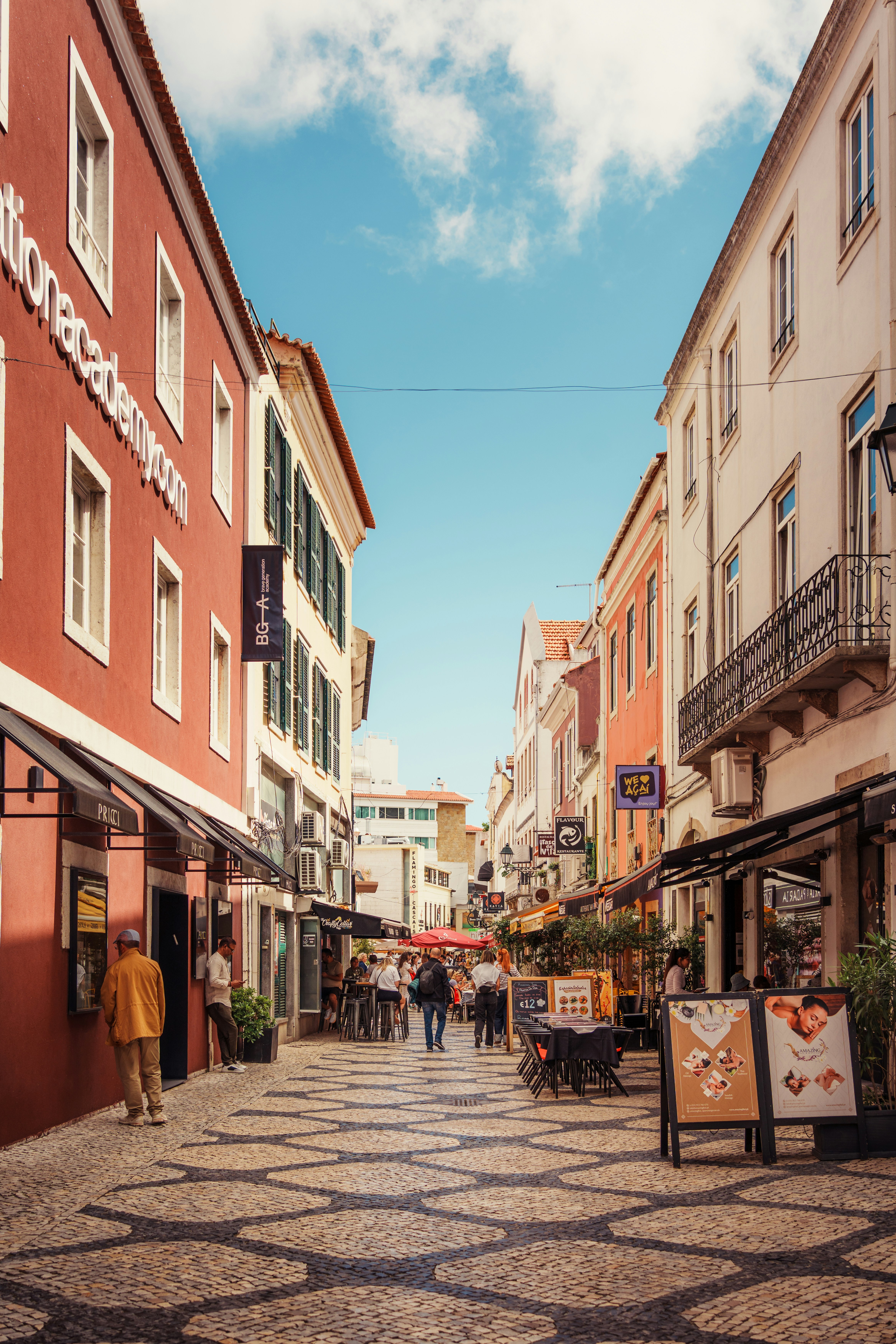 Cobbled Street Café Corridor Under a Bright Portuguese Sky