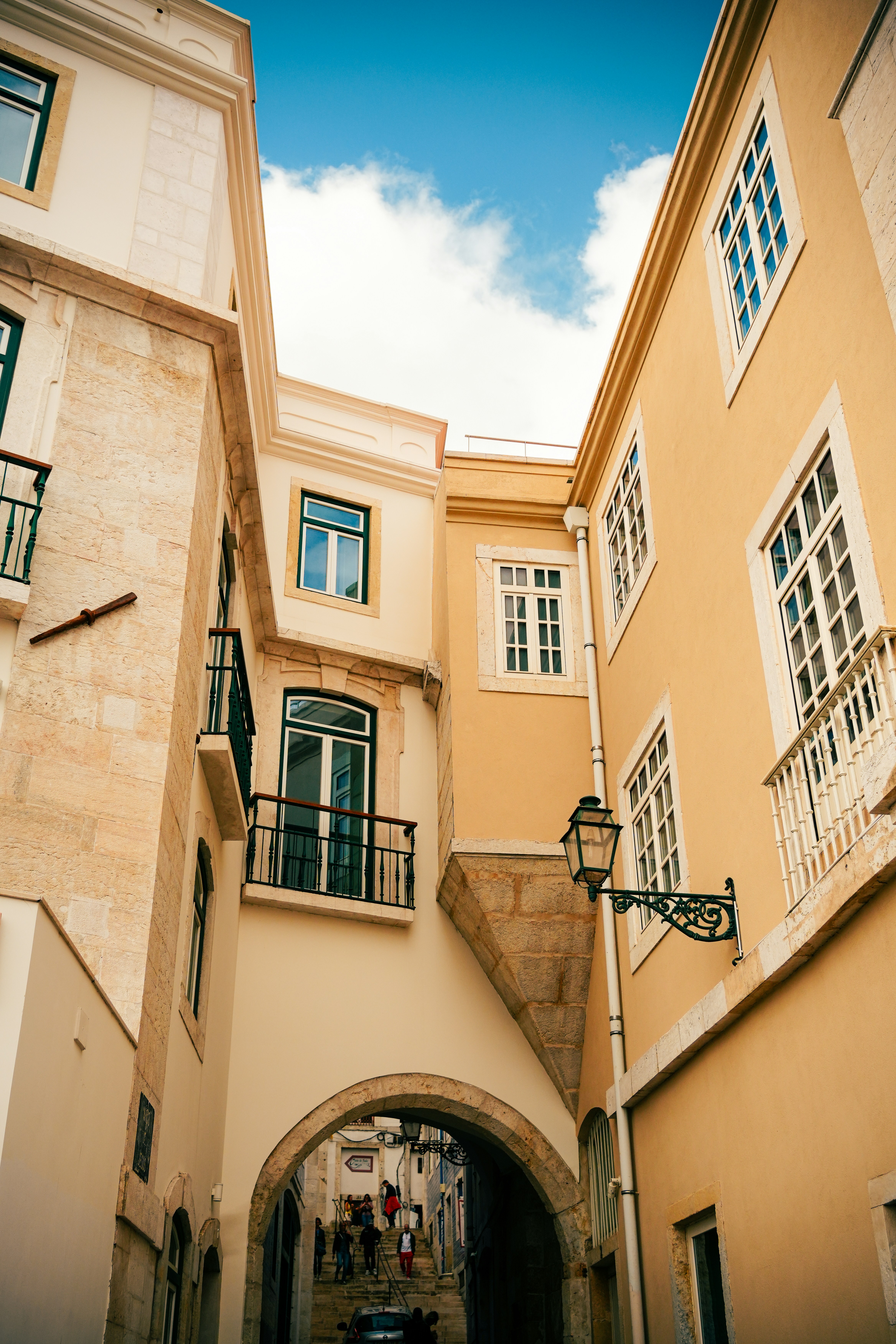 Sunlit Archway: A Narrow Piazza Framing a Cantilevered Passage