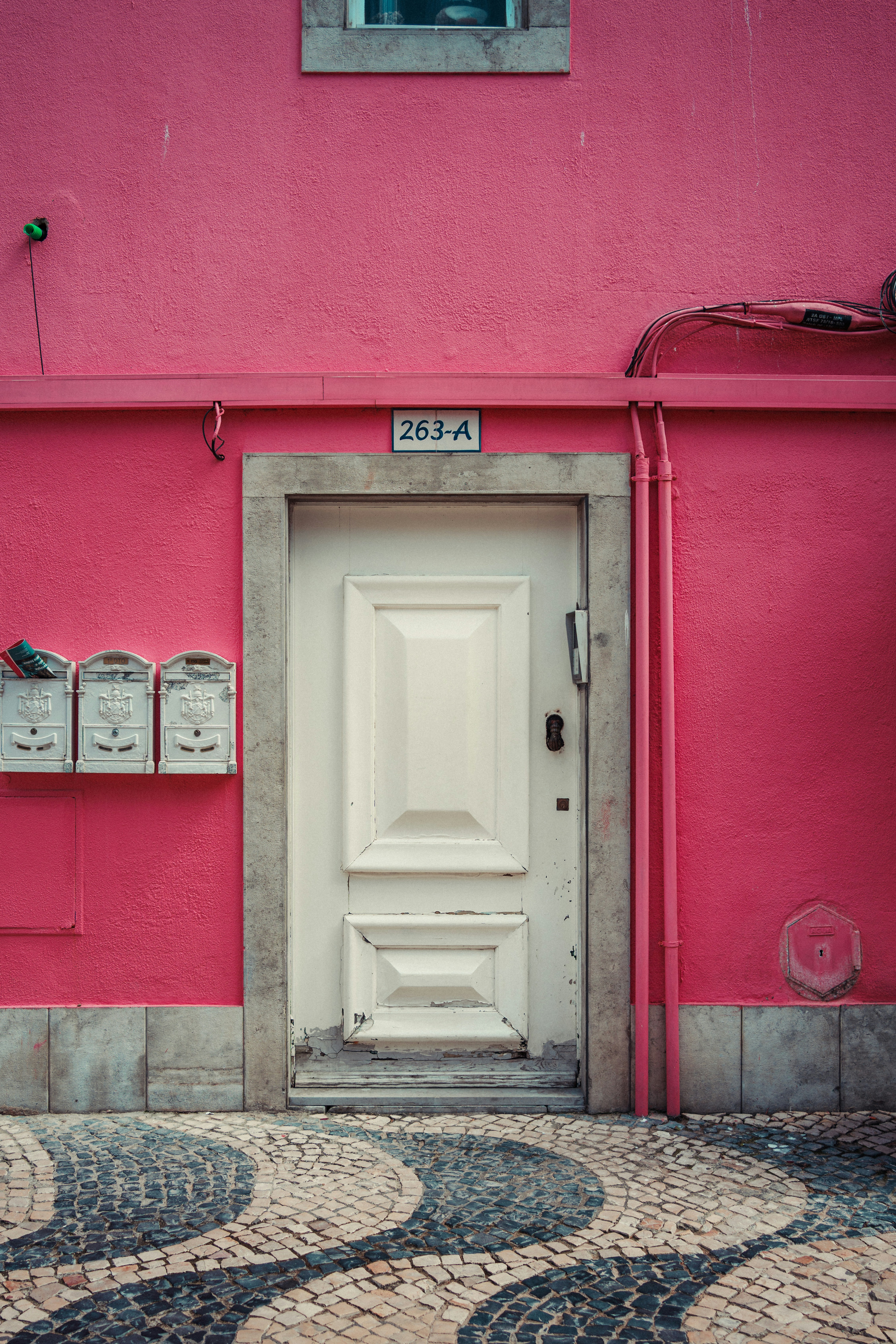 Pink Facade with Central Doorway