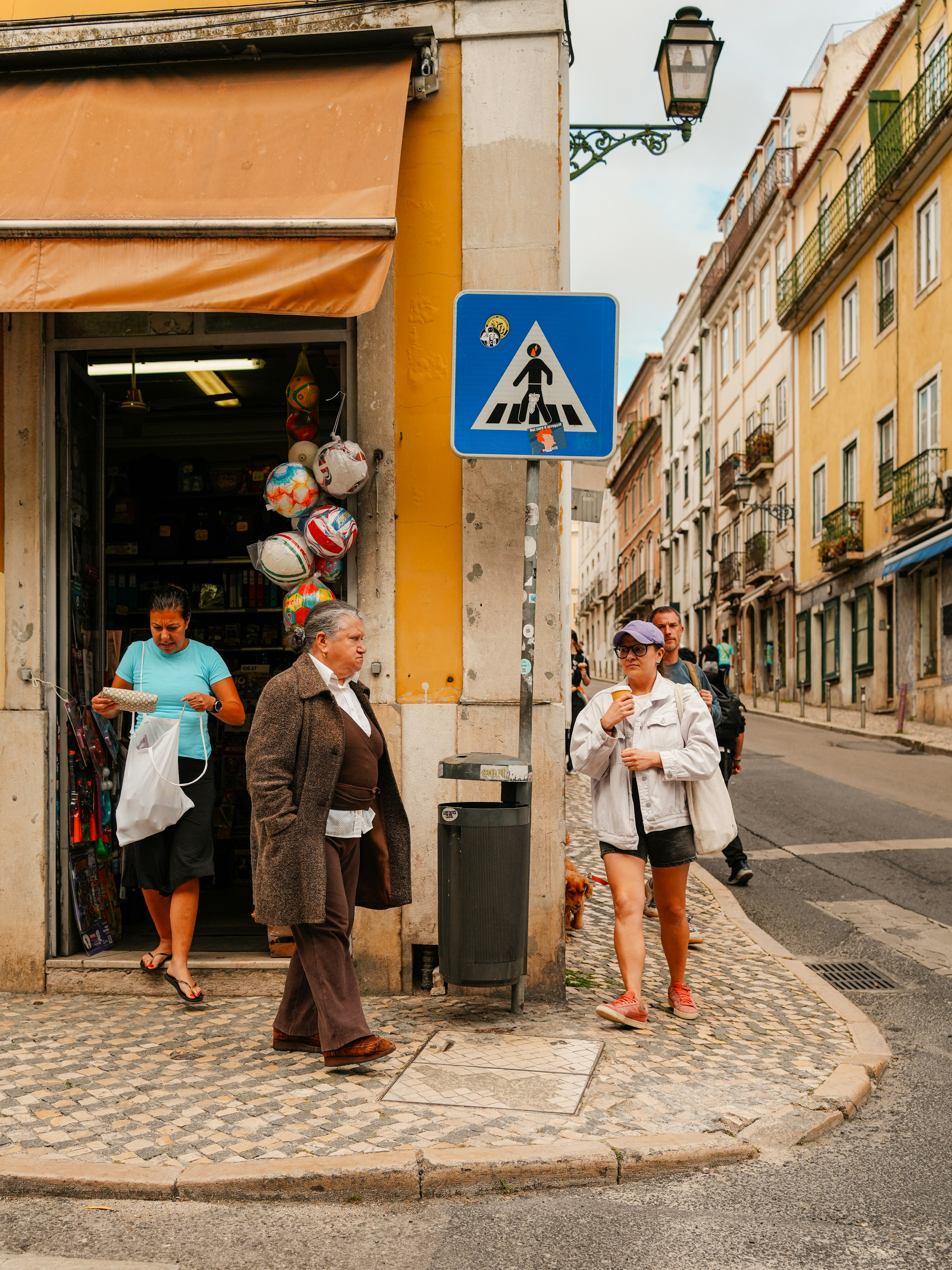 Crosswalk Conversations on a Sunlit Portuguese Street