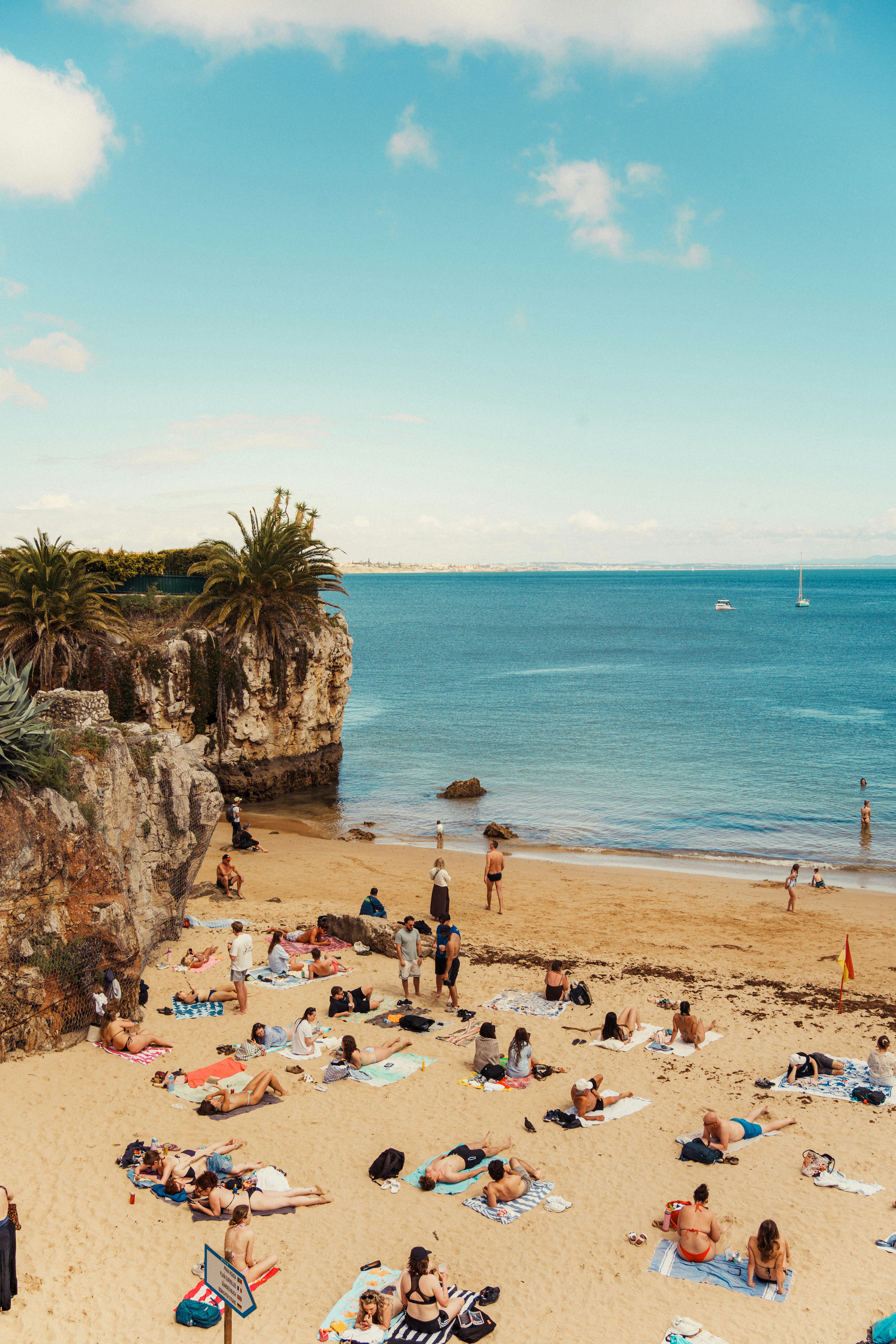 Sunlit Beach Gathering at the Cliffside