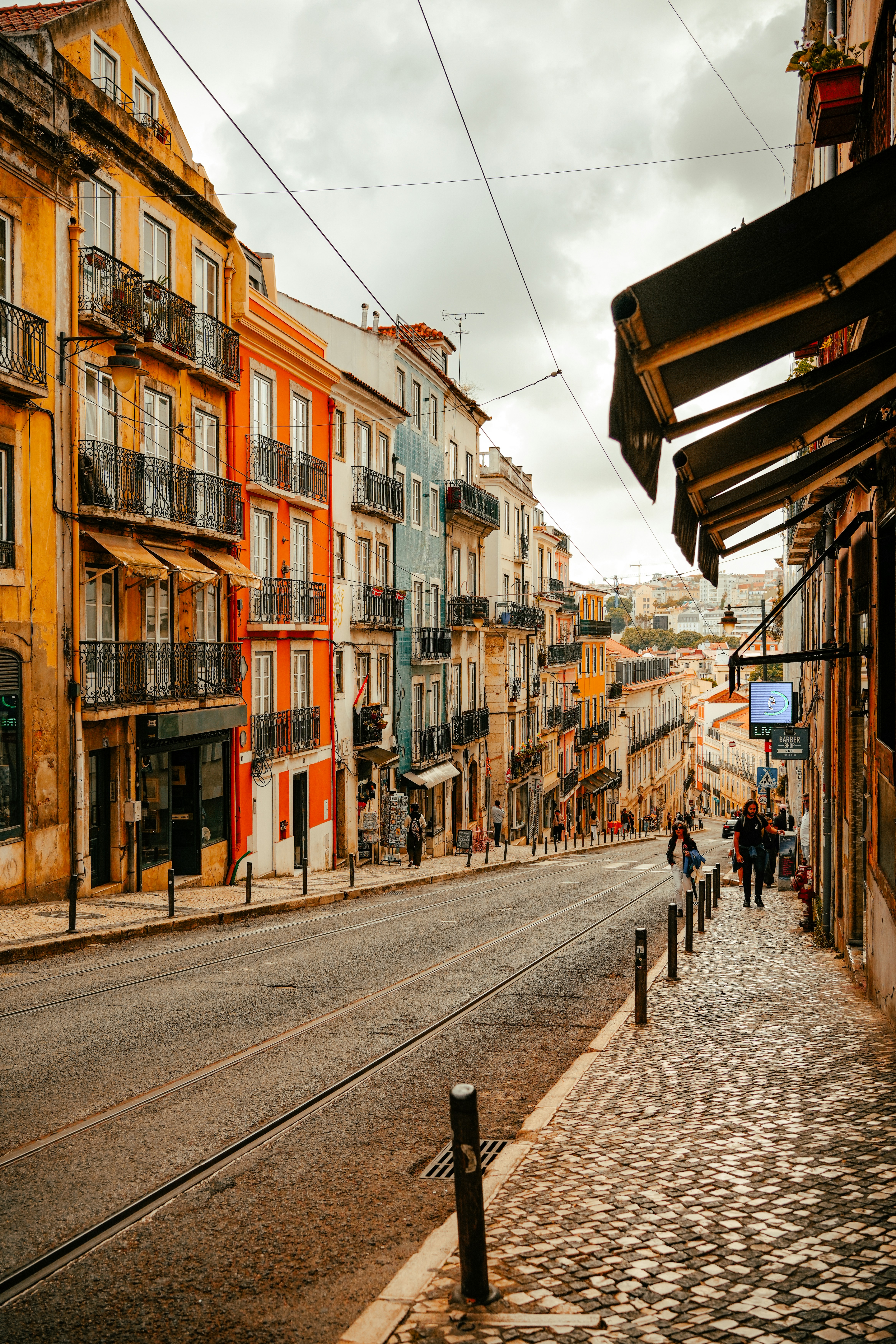 Colorful Lisbon Street Slopes Toward the River