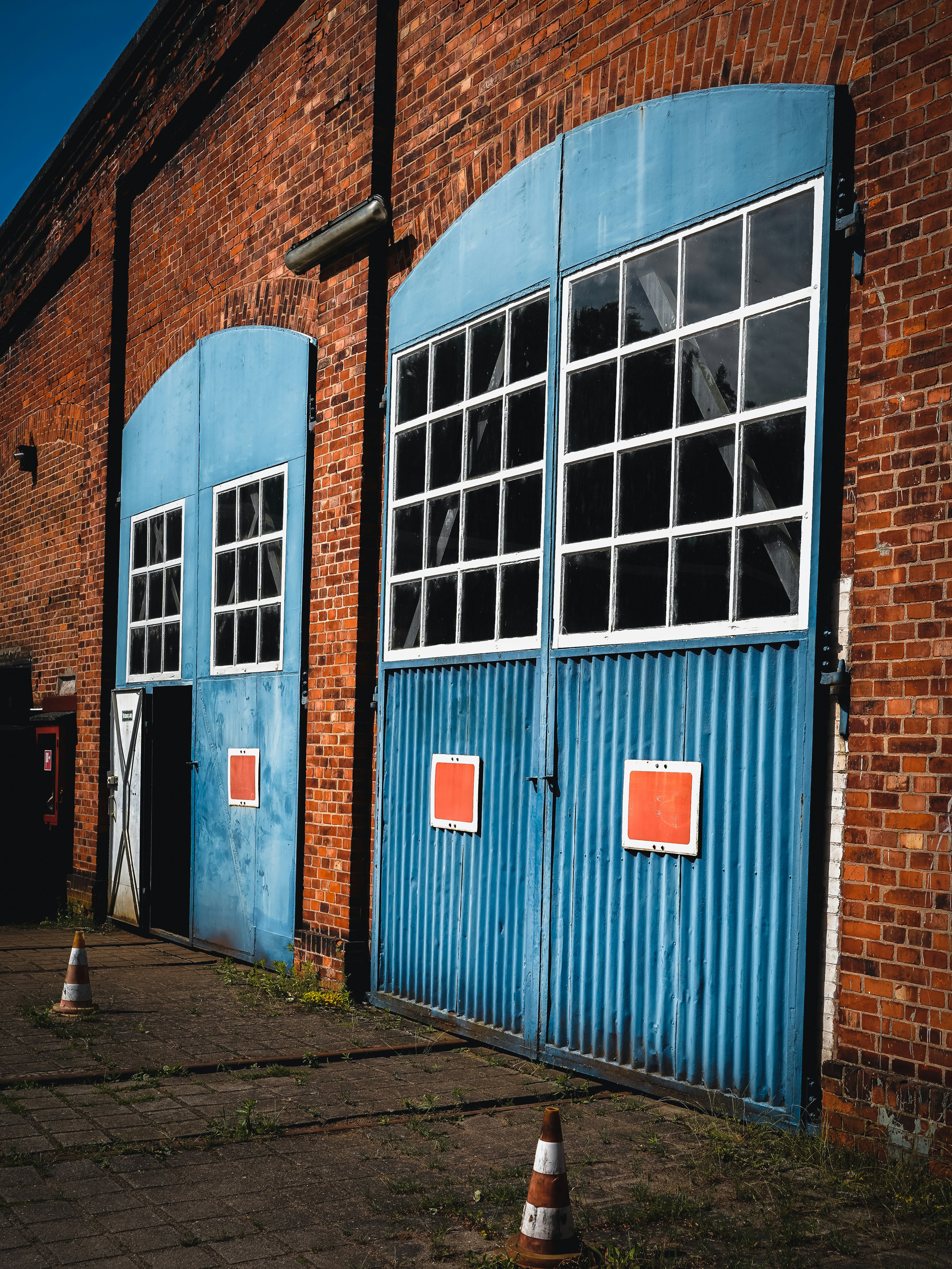 Blue Industrial Doors: A Facade of Brick and Steel