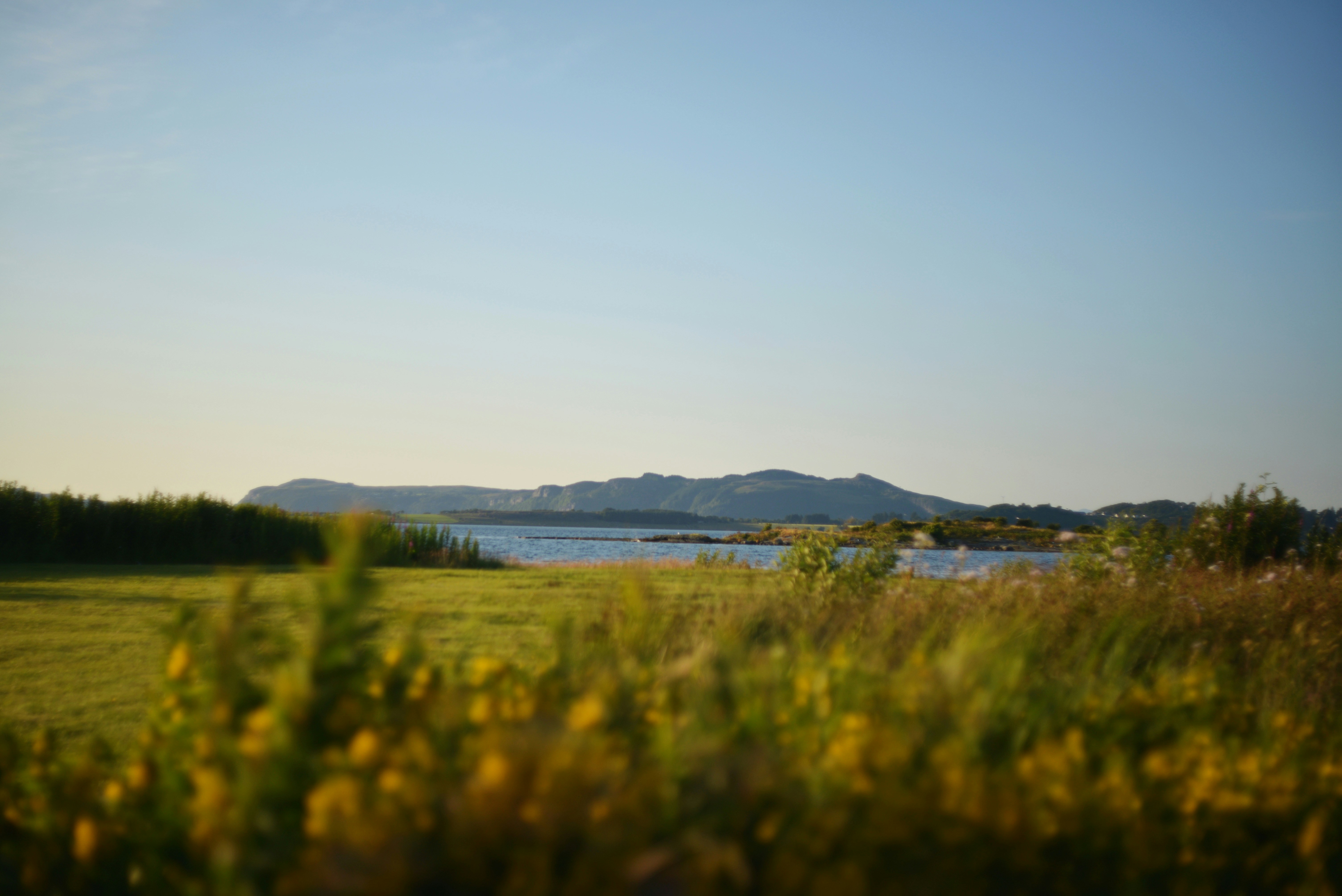 Golden Strip: Distant Hills and Quiet Water
