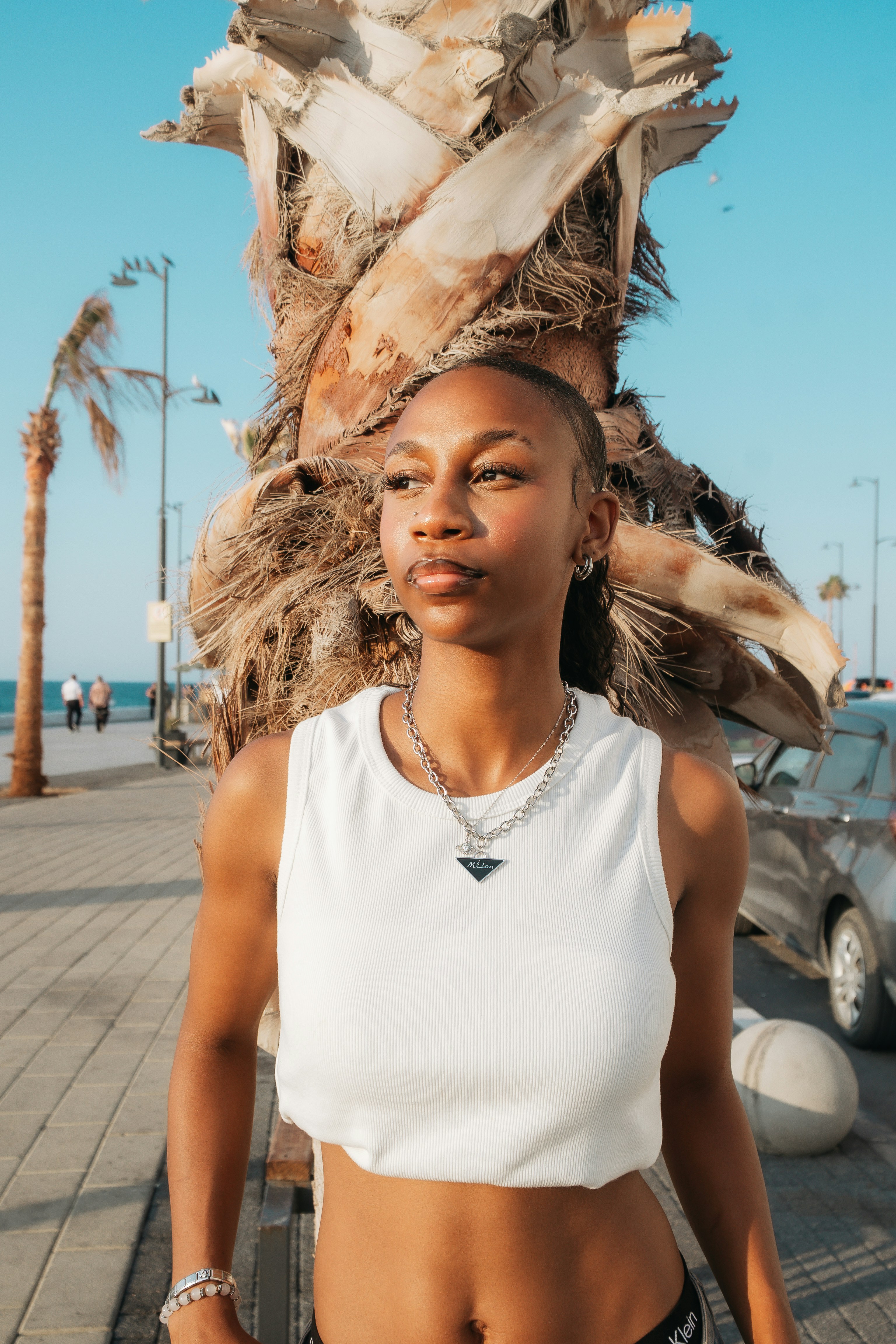 Sunlit Confidence: A Portrait by the Sea Front