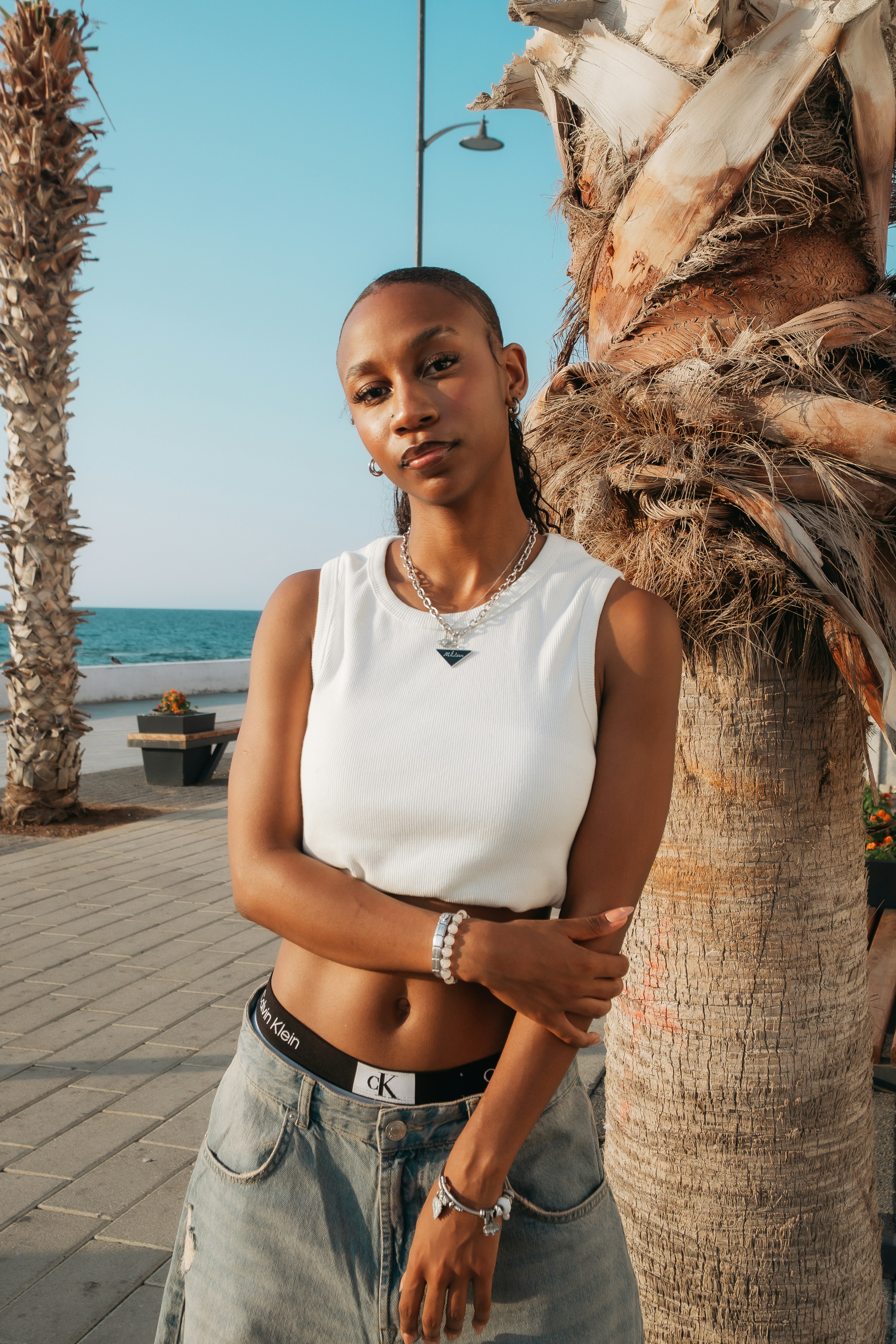 Midday at the Palms: Confident Portrait by the Sea