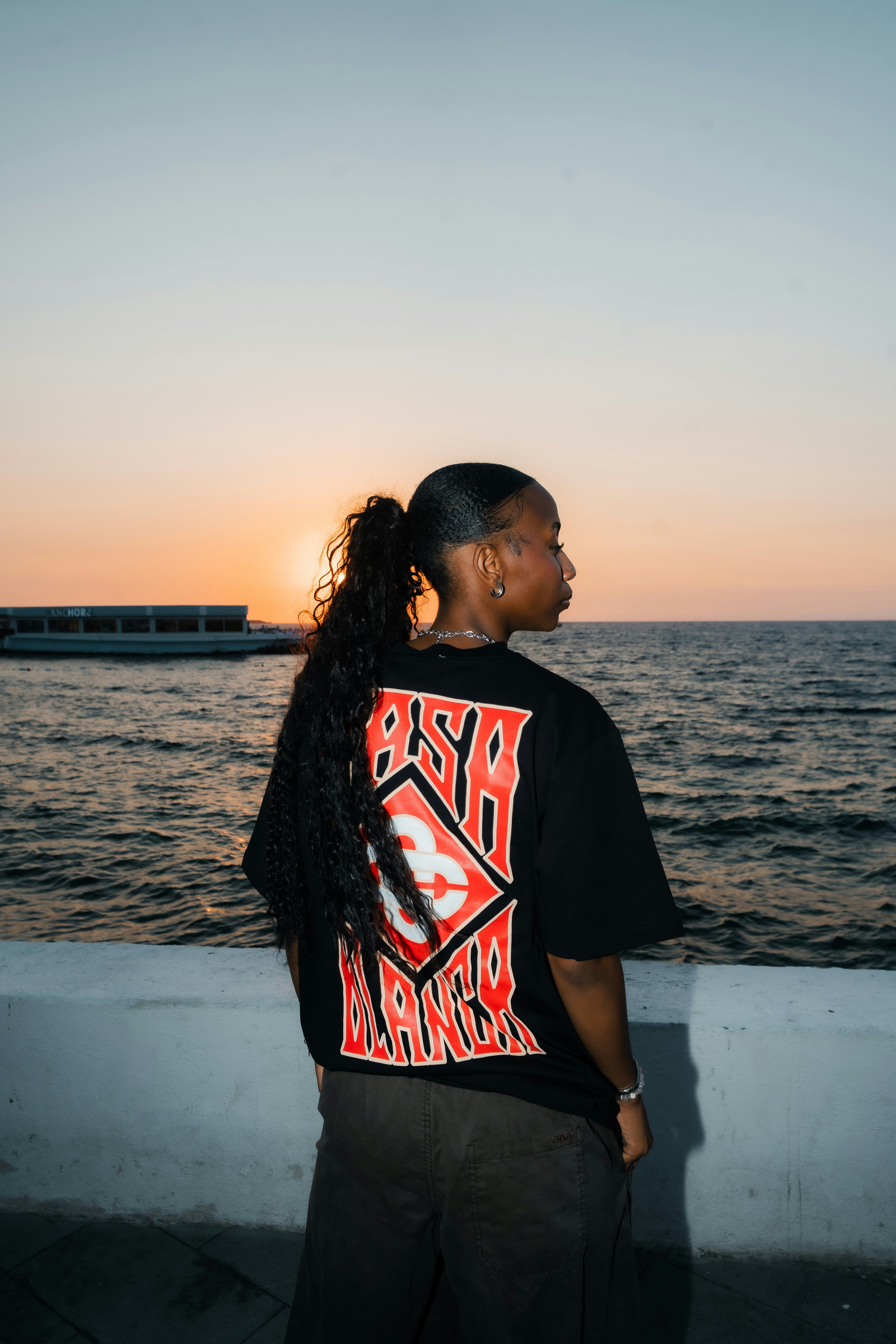 Sunset Portrait on the Pier: Backlit Confidence