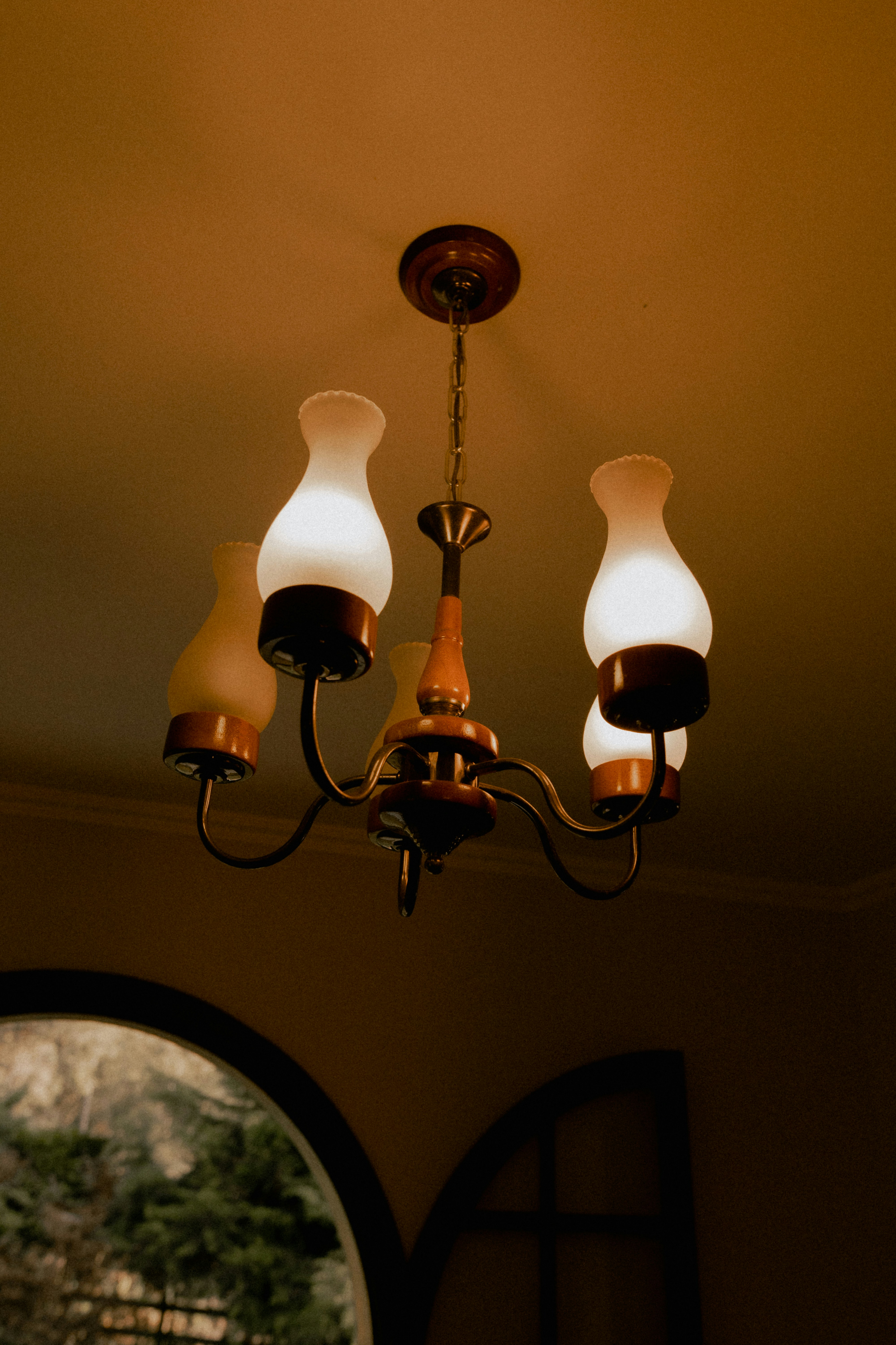 Warm Glow: Vintage chandelier lighting in a dim interior