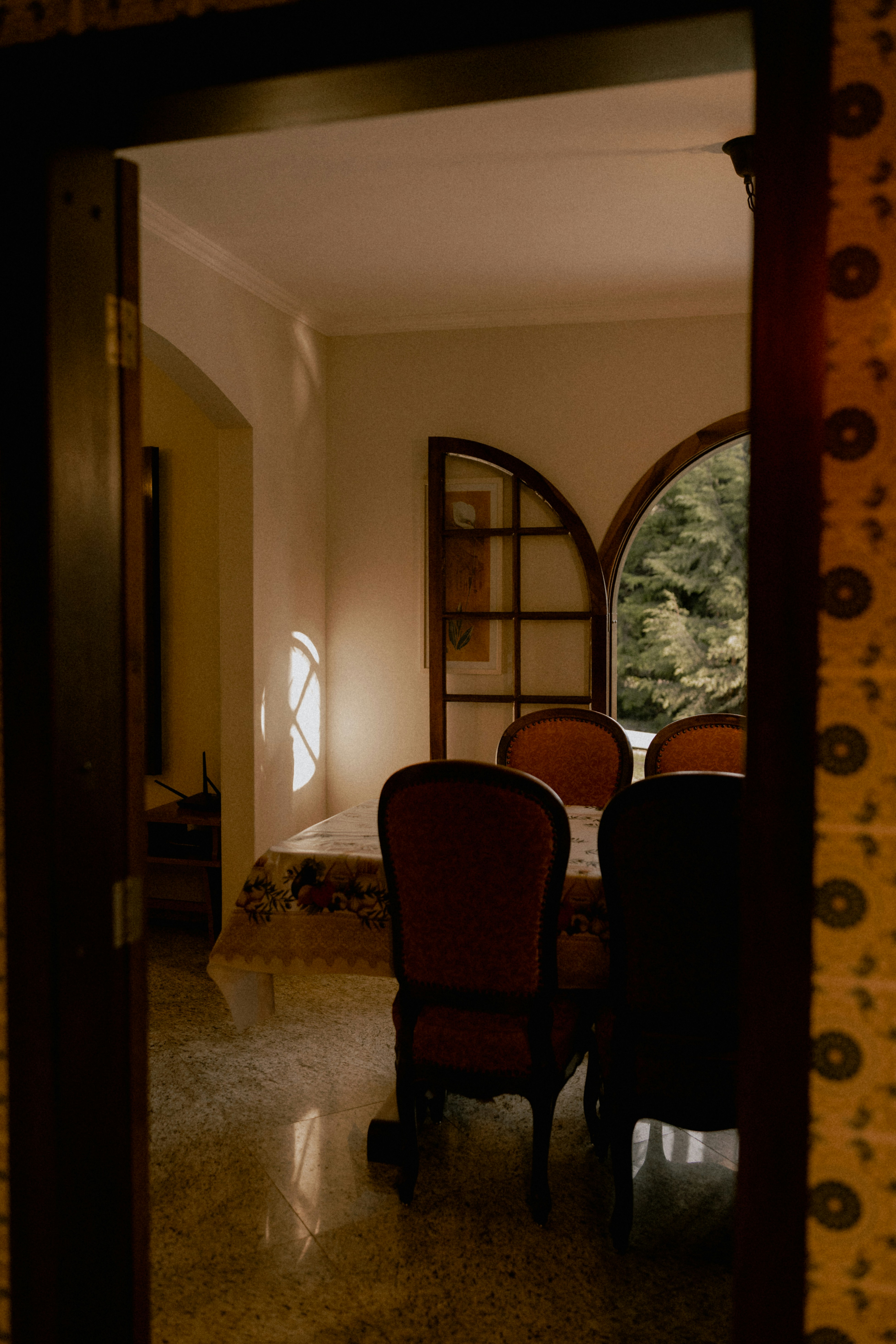 Dining Room Through a Frame of Wavy Doors