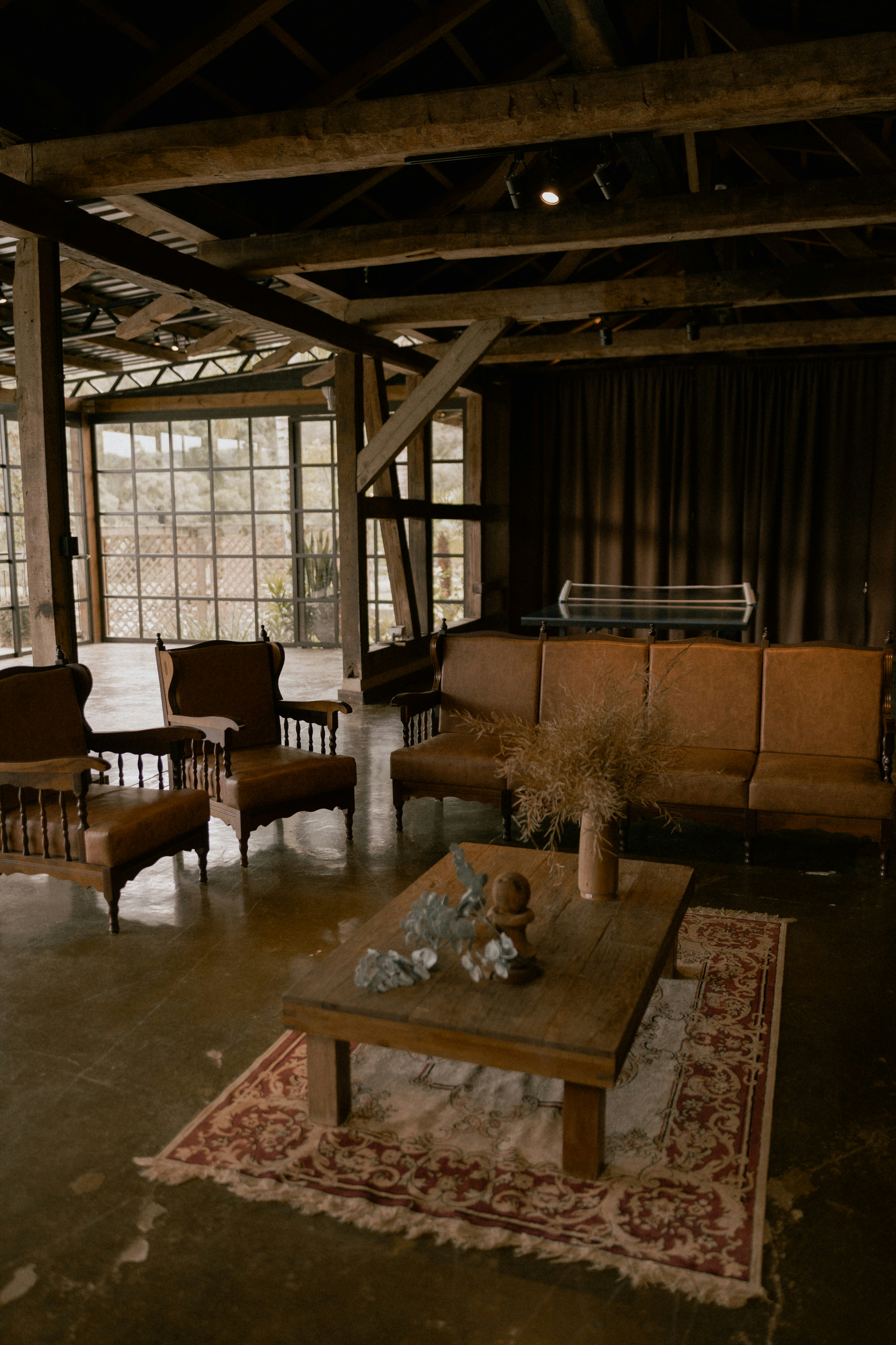 Quiet Lounge in a Rustic Studio with Wooden Beams