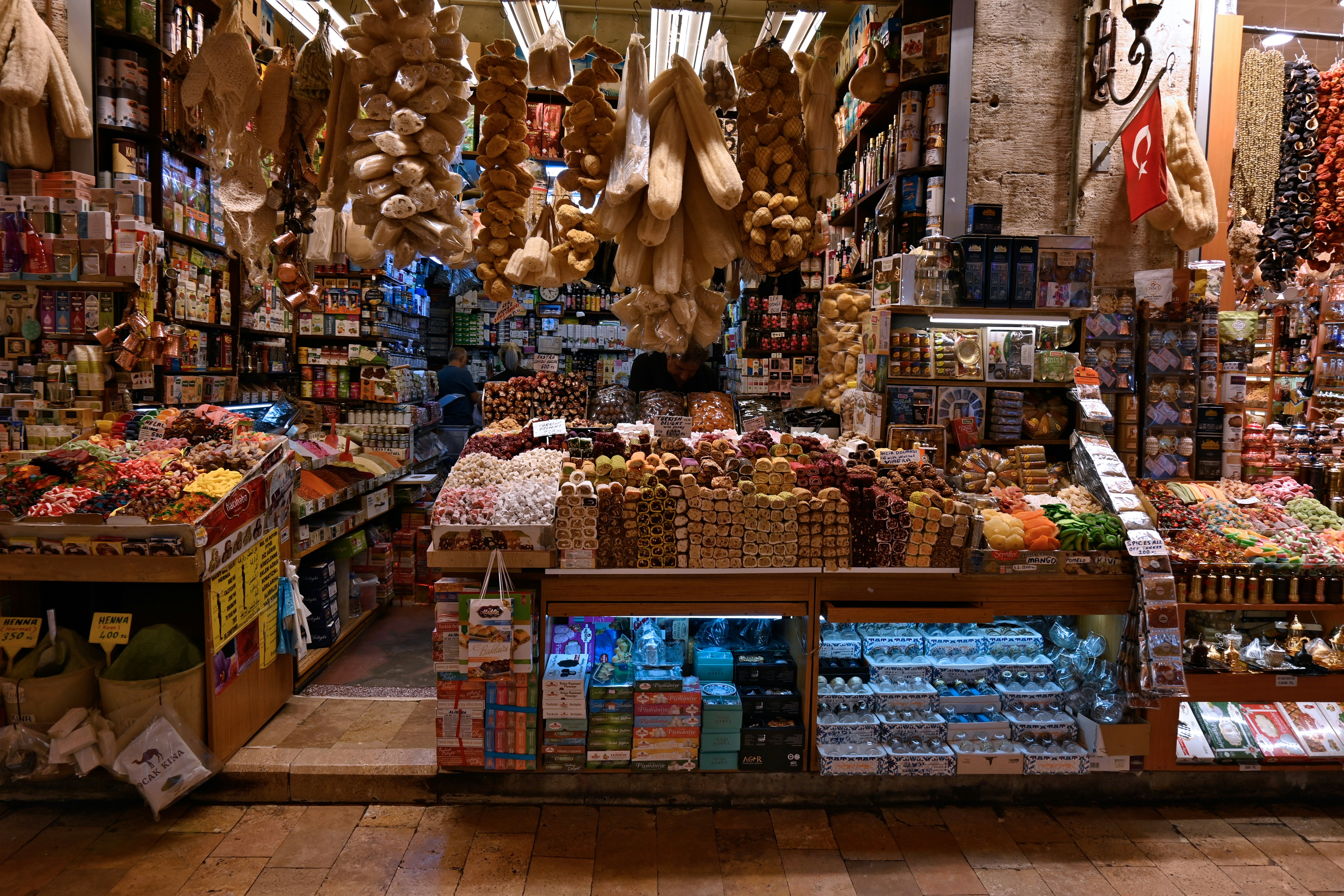A Market Stall of Aromatic Treasures: Dried Goods and Treats Under Warm Light