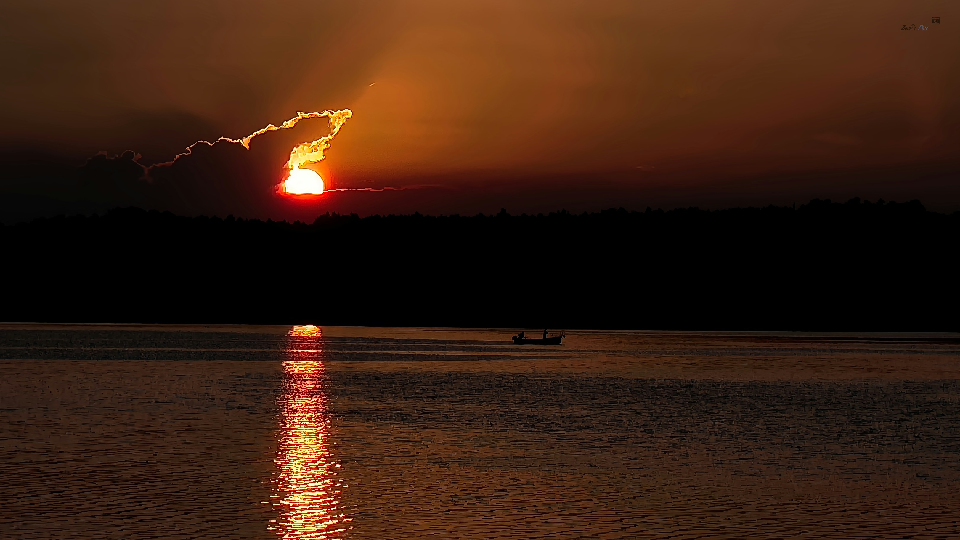 Glowing Horizon: Sunset over a Quiet River