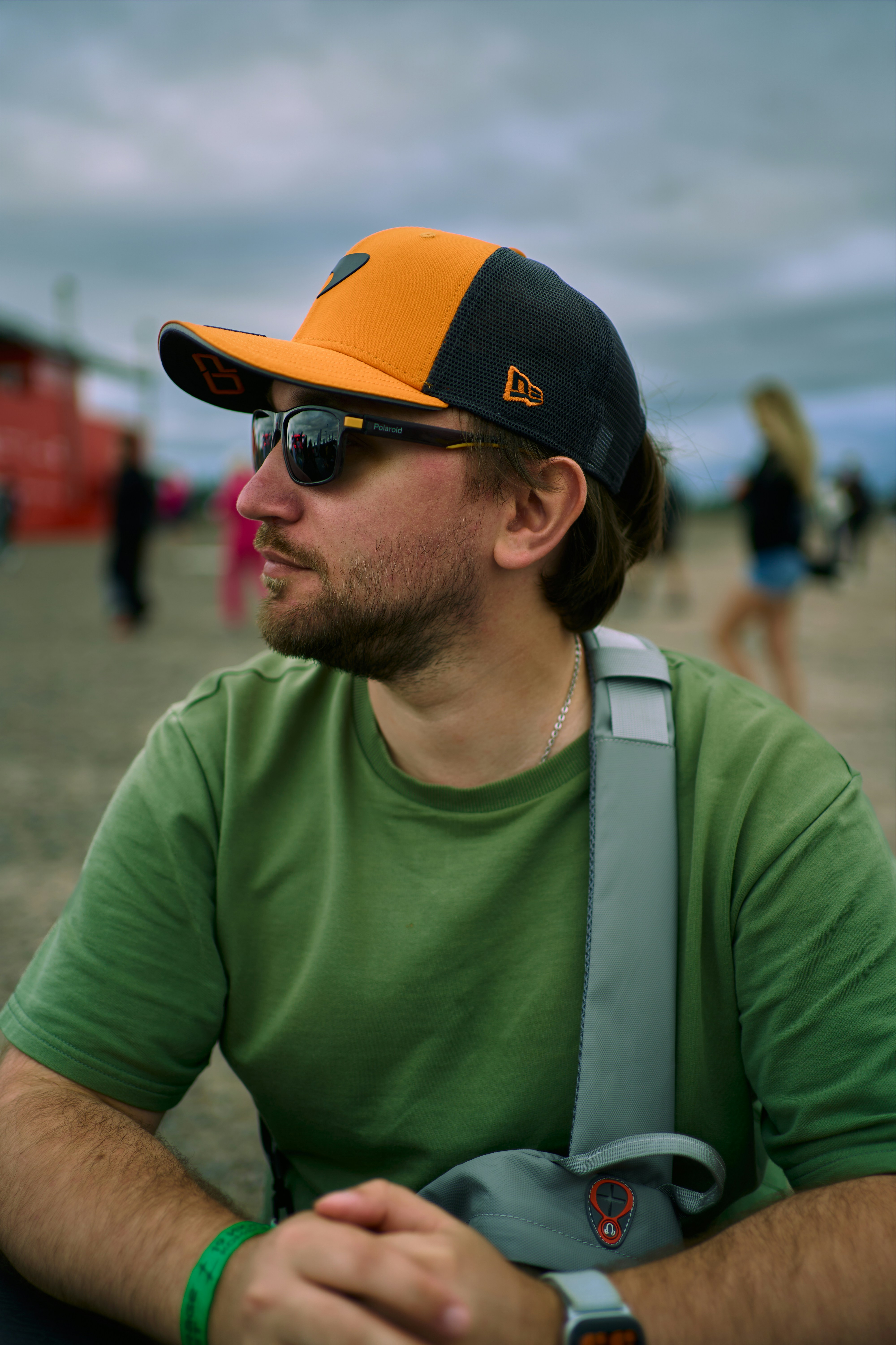 Portrait at the Beach: A Man in an Orange-Gray Cap and Sunglasses