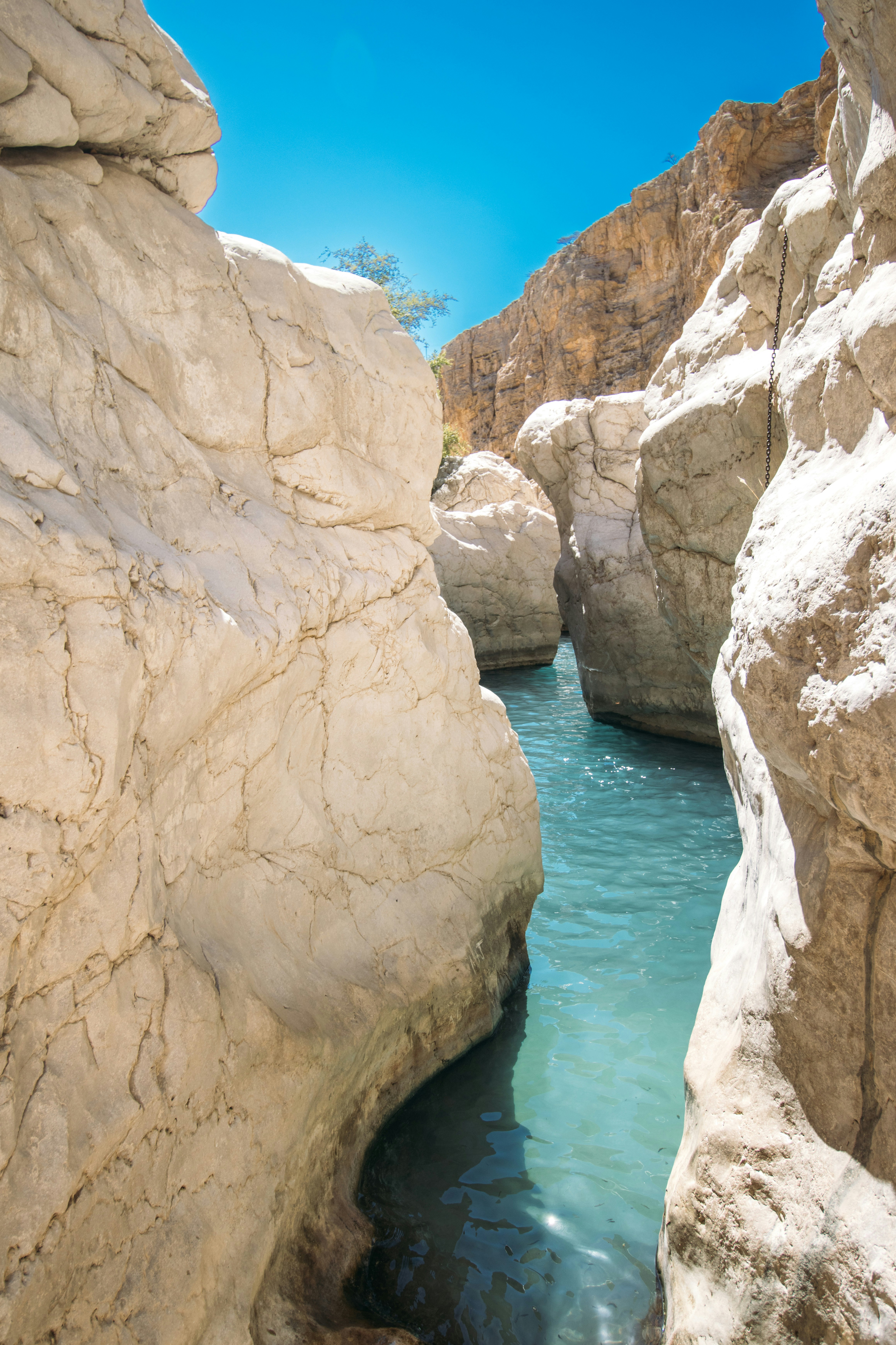 Between towering limestone gates over turquoise water