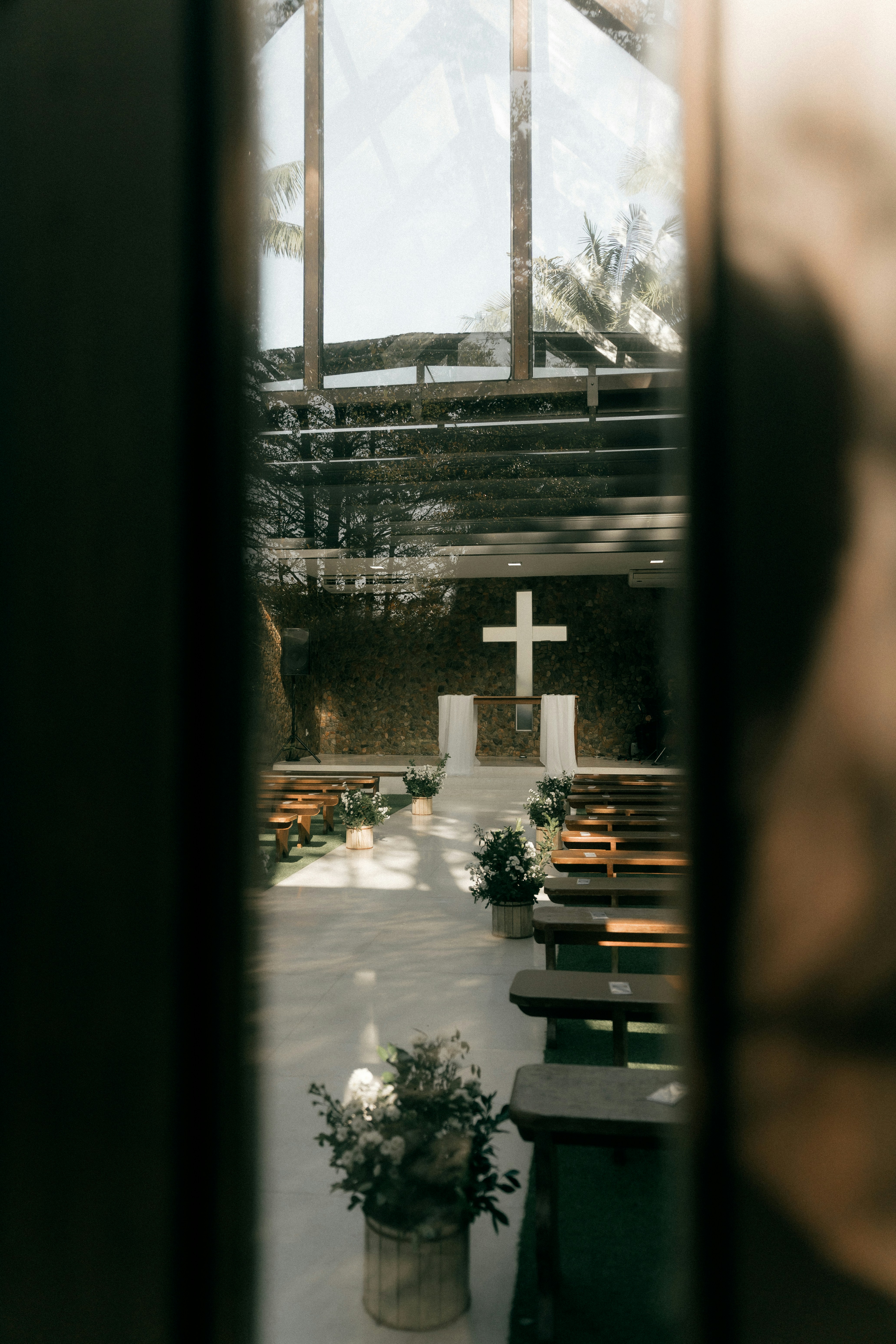 Sanctuary at Dusk: A Quiet Cross Framed by Windows