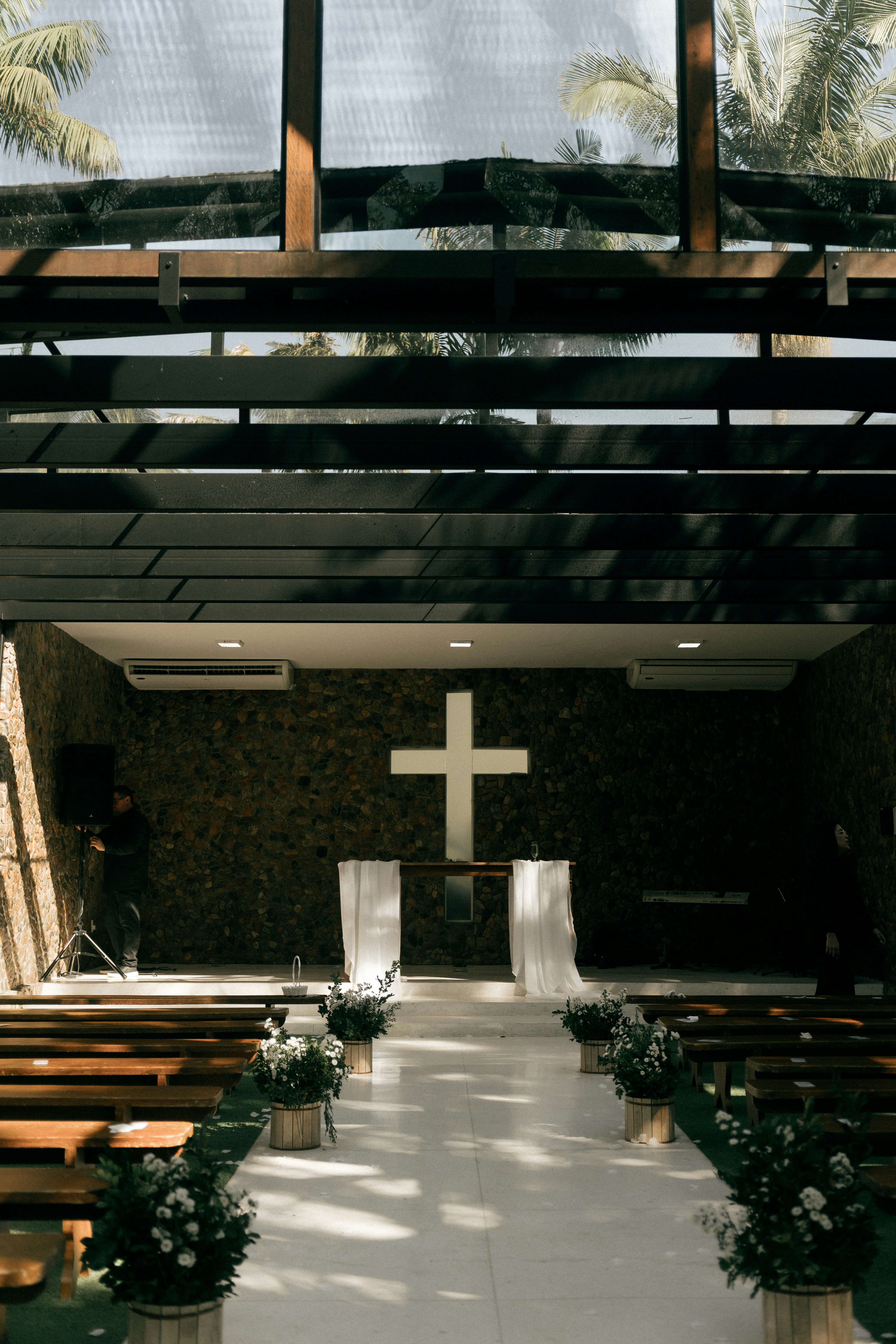 Cross & Choir Aisle: Quiet Ceremony Under Shelter of Beams