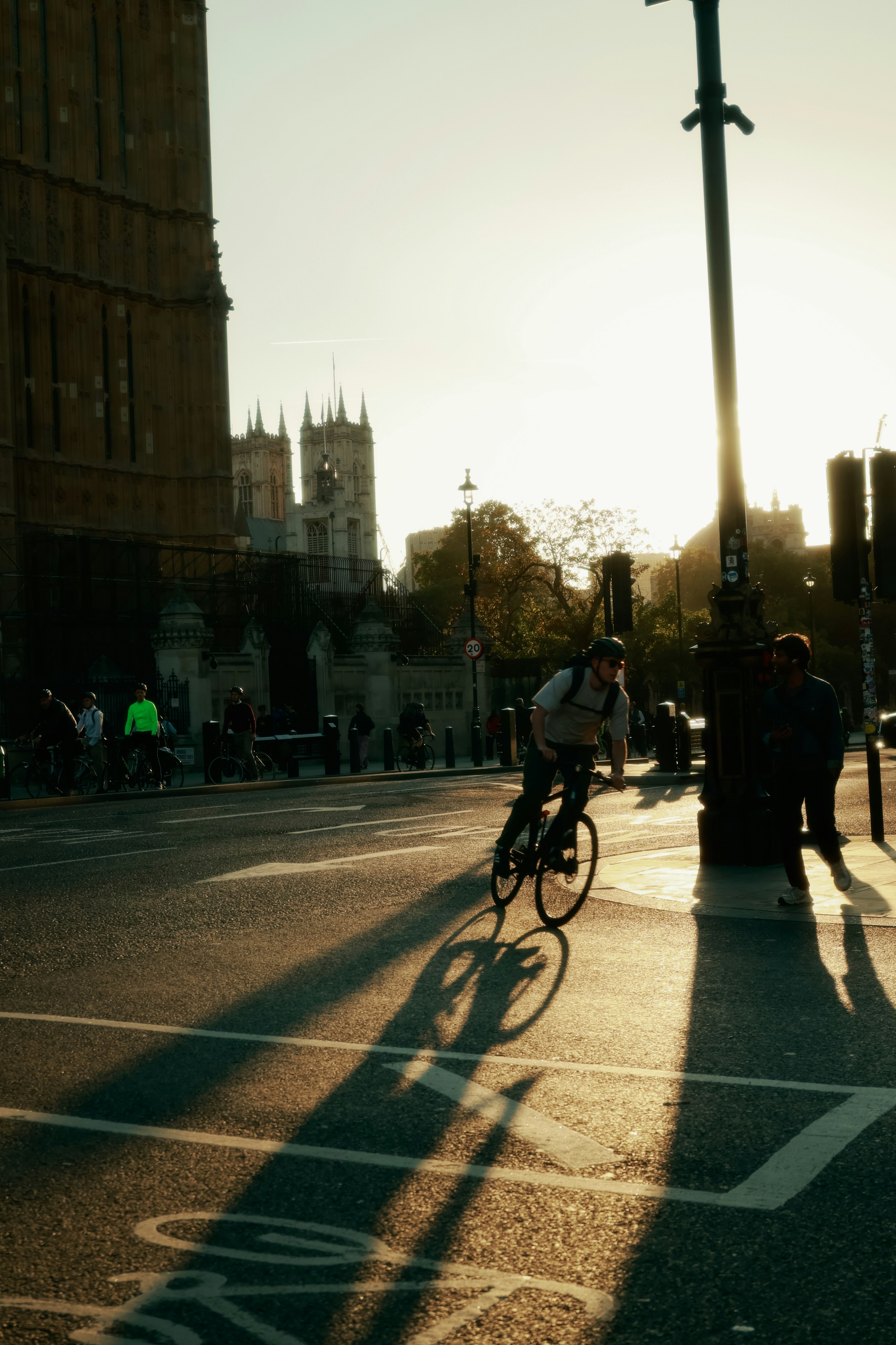 Urban Sunrise Cyclist: Shadowed Lane of Westminster