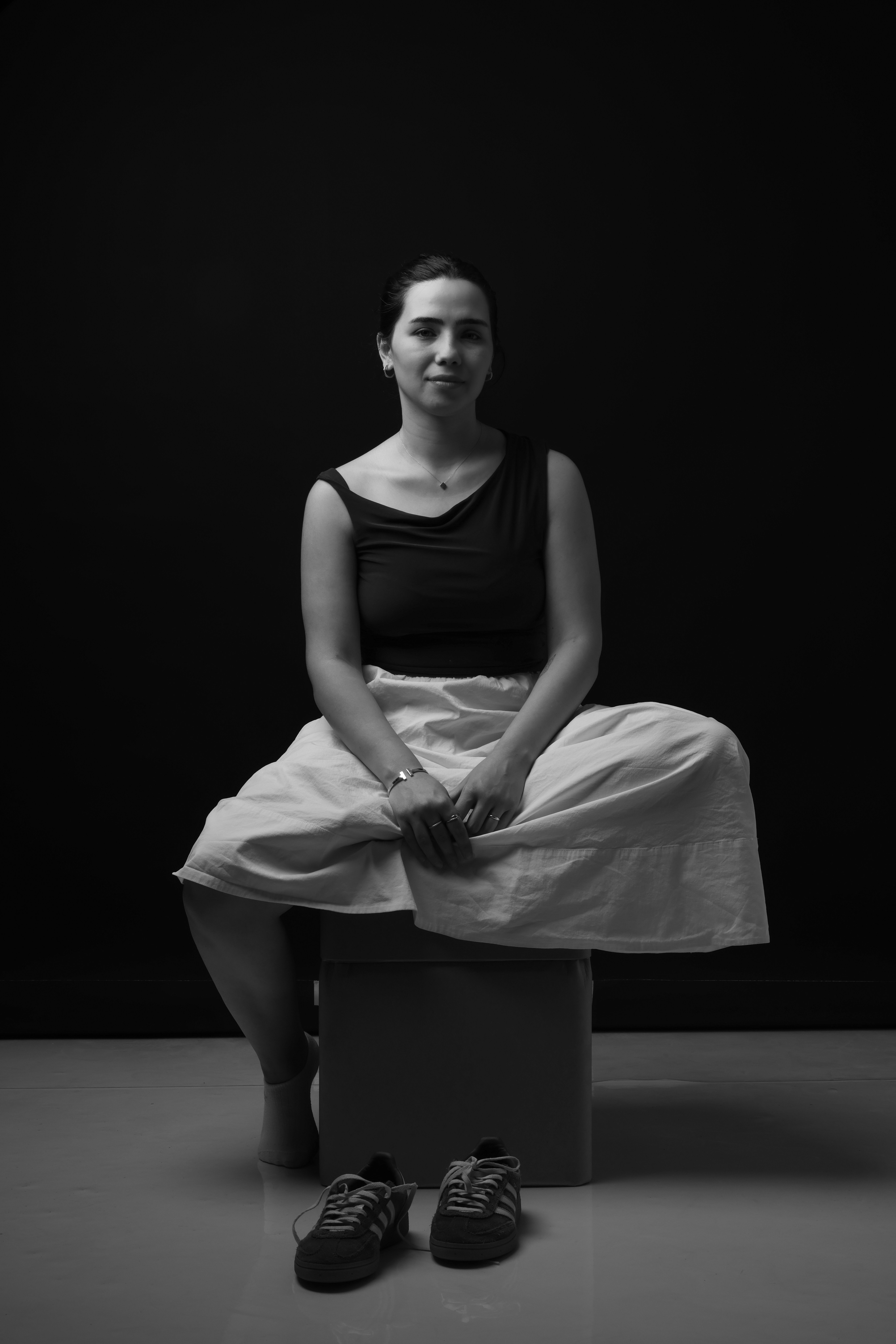 Portrait in Shadow: Quiet Poise on a Box