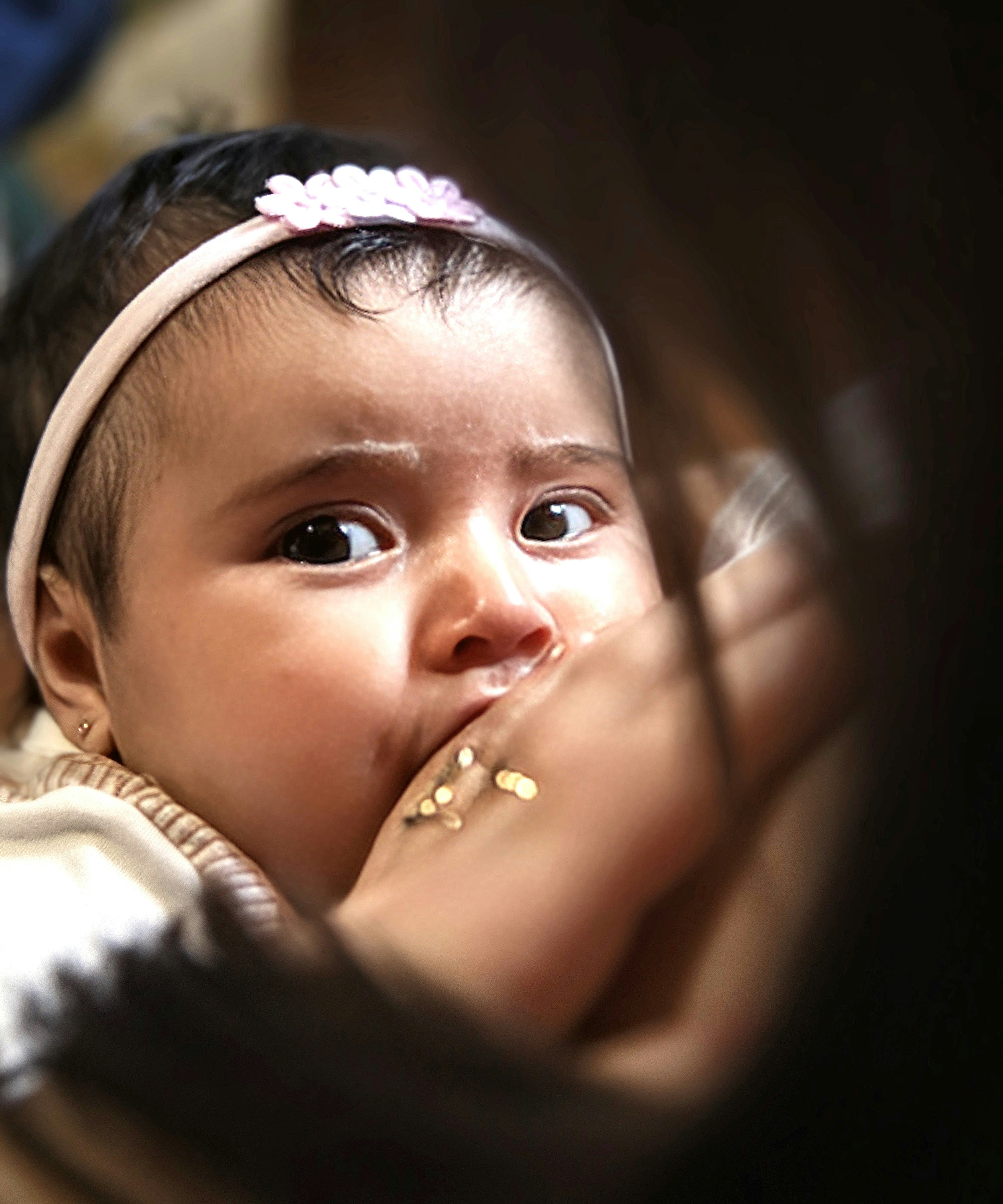 Close-Up of a Baby's Curious Gaze During Intimate Feeding Moment