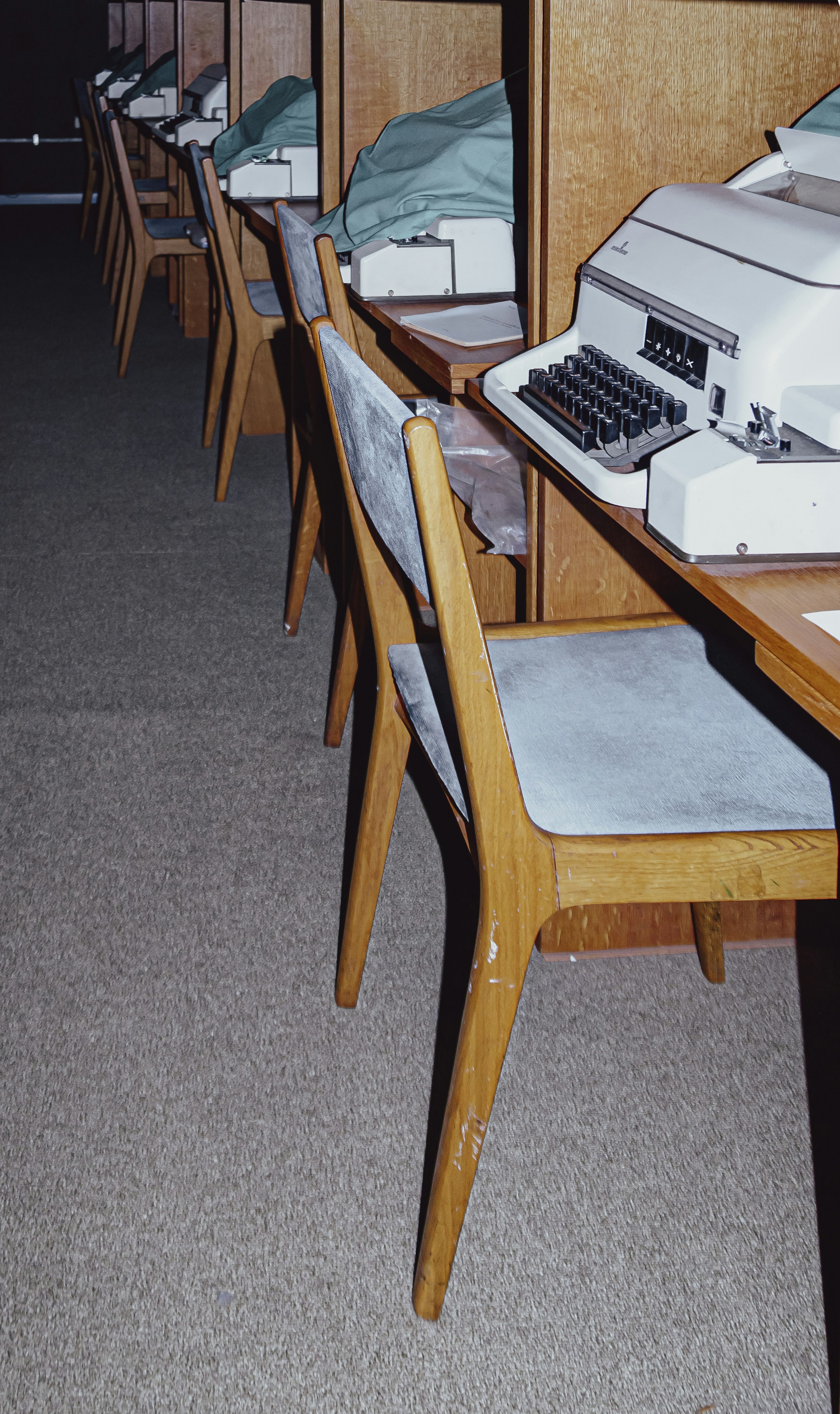Deserted Typing Console Row in a Diner-like Utility Room