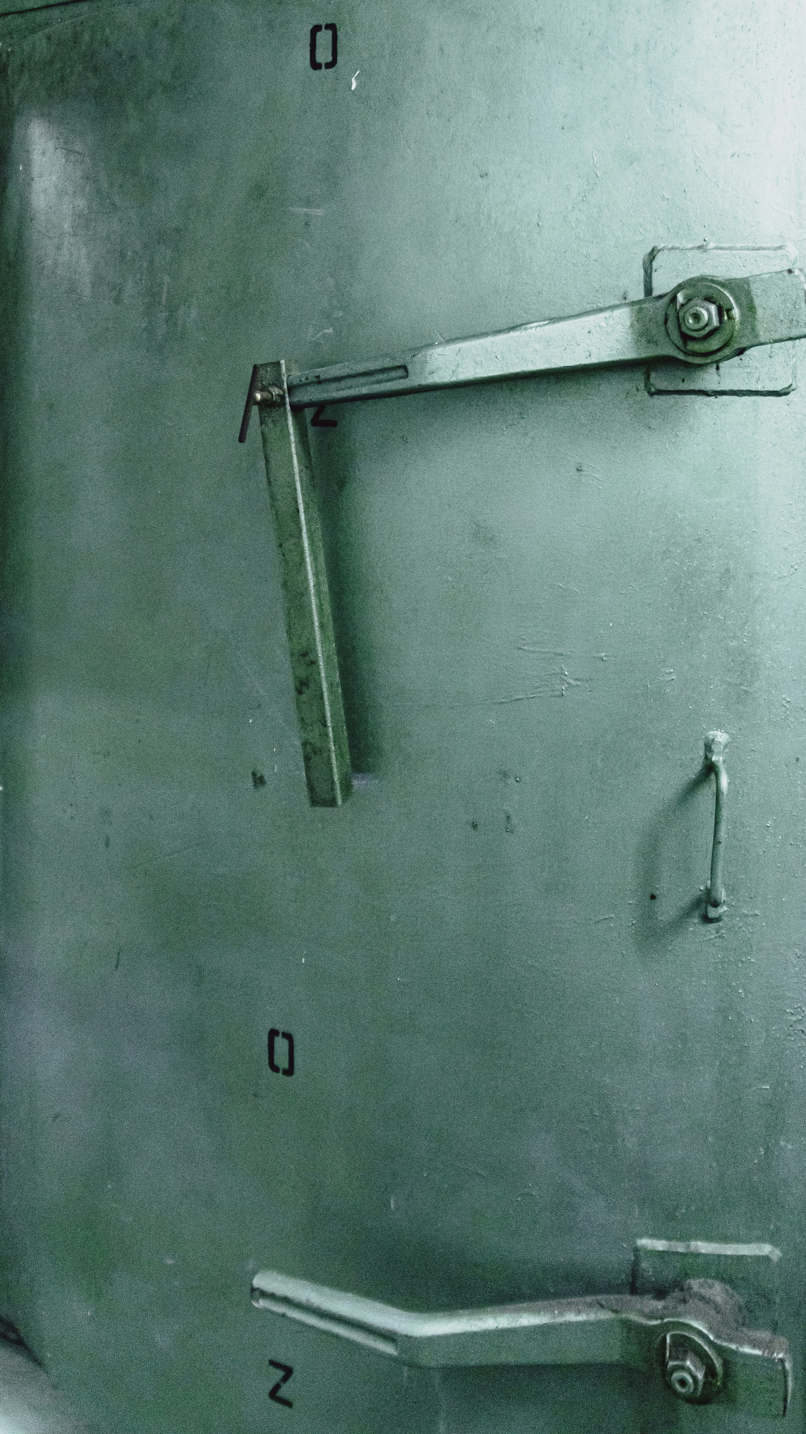 Industrial Door Mechanisms in Minted Green Light