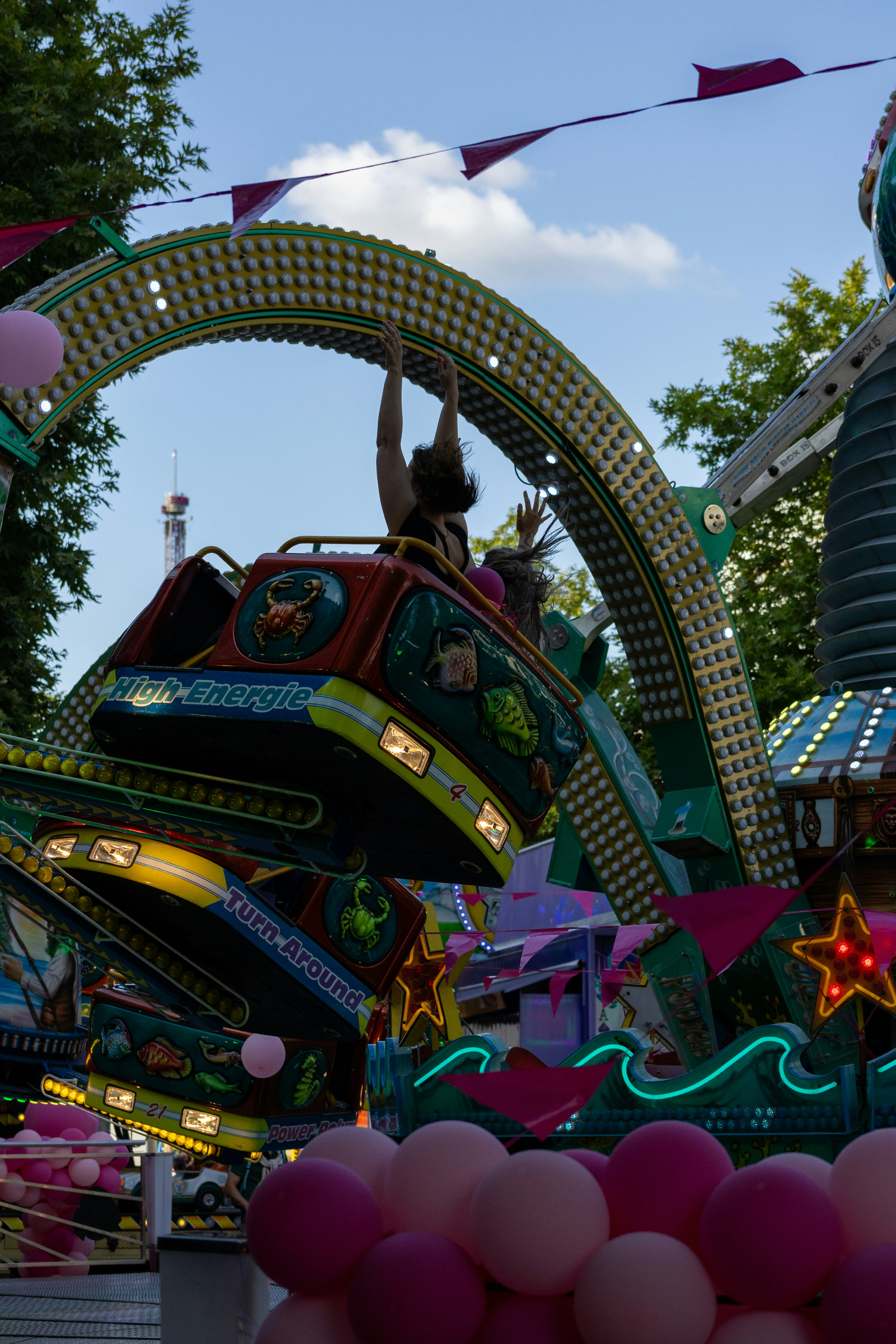 Riding the Neon Ring: A Carnival Car Ride in Motion