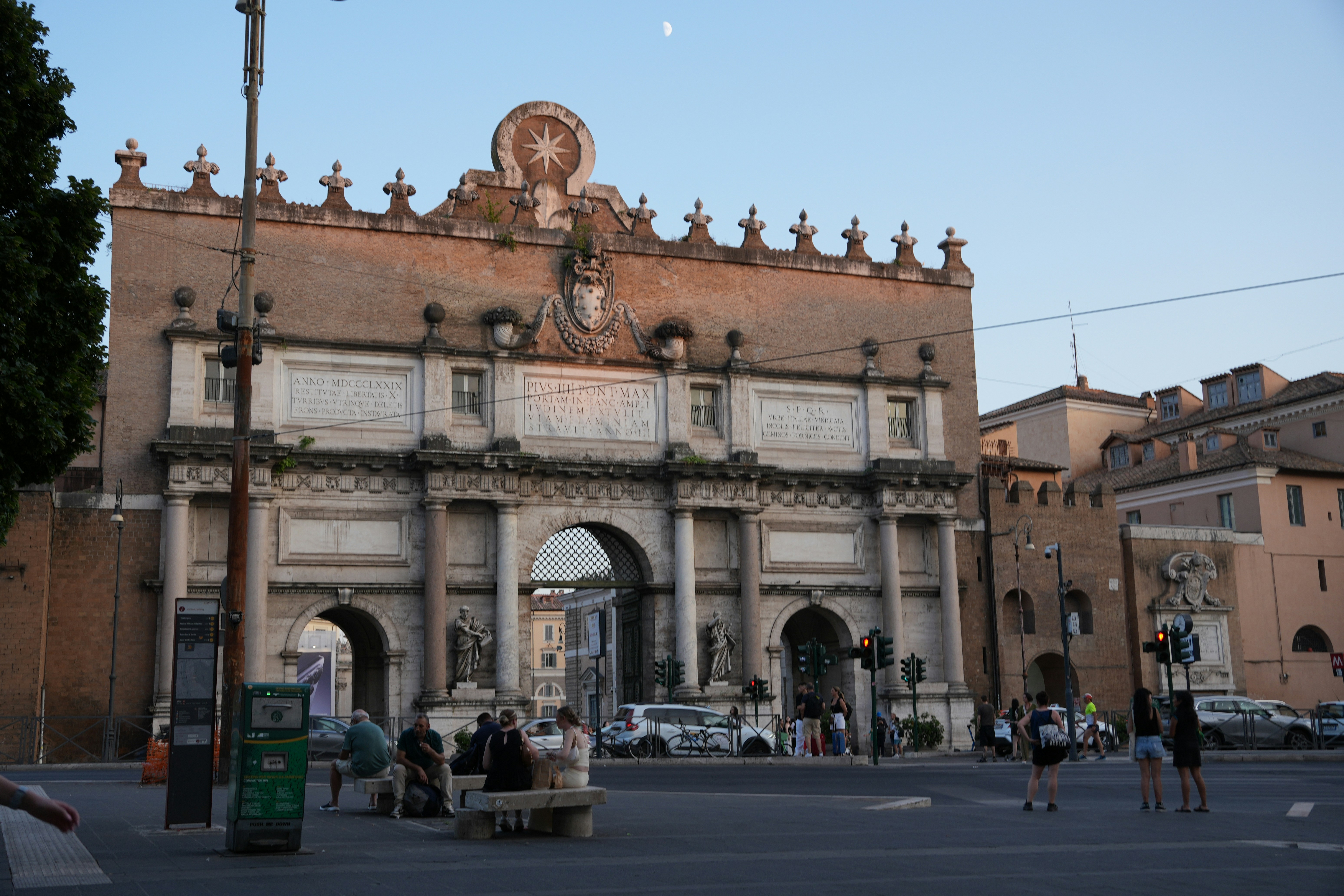 Triumphal Arch Gate Surrounded by Rooftop Ornamentation in the City Square