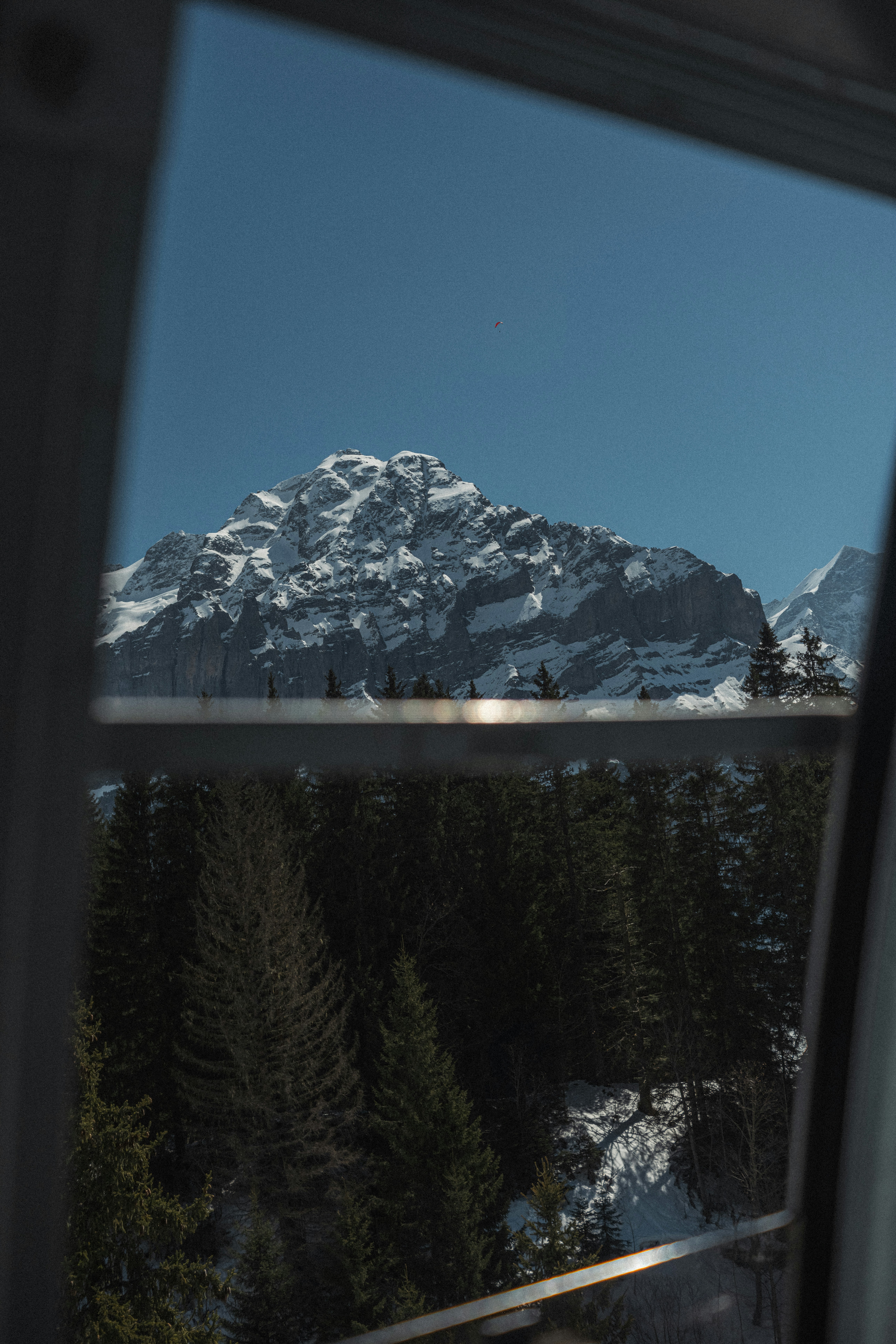 Wintry Peak Framed by Window Glaze